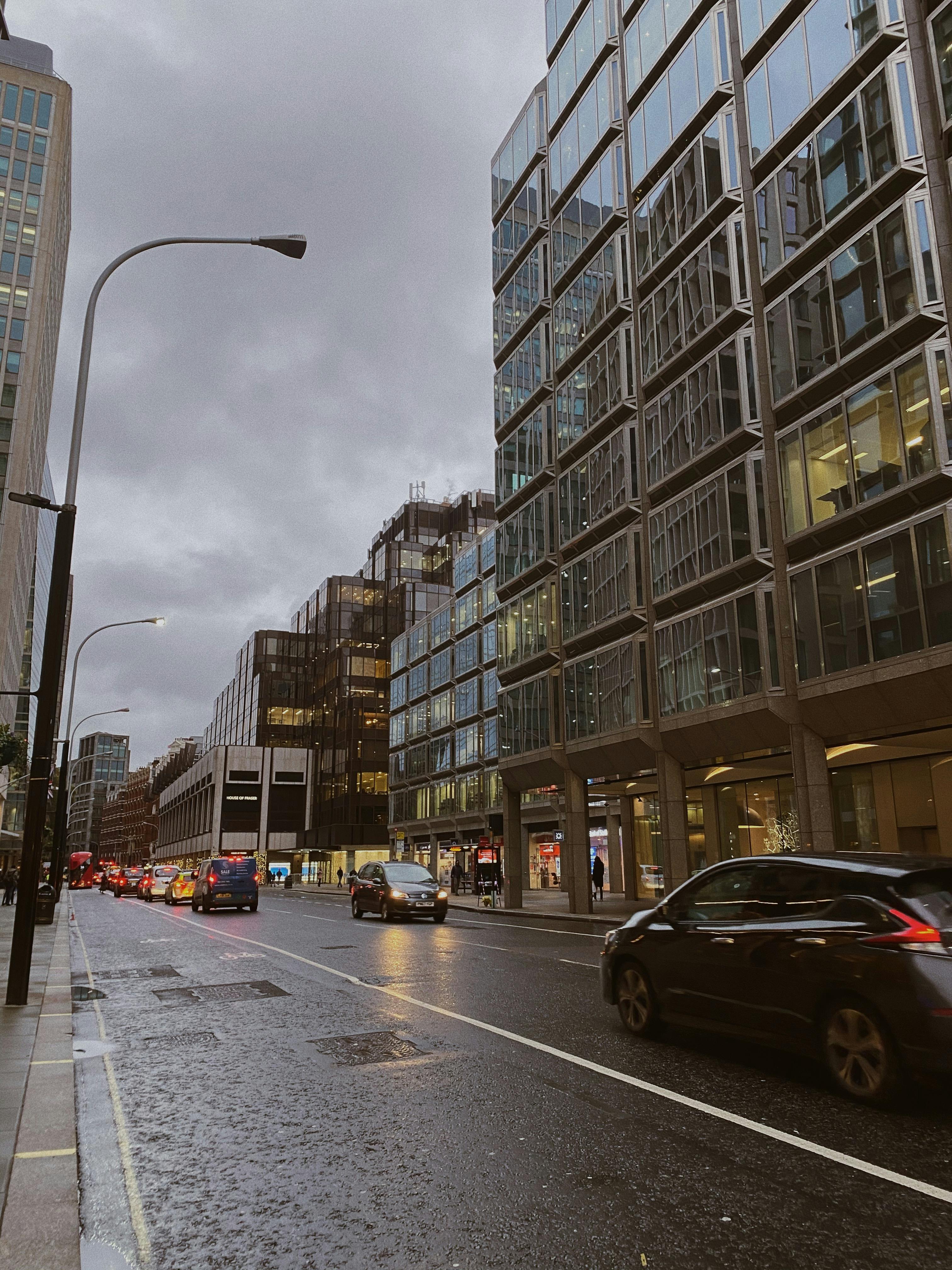 Parked Cars between the Concrete Buildings · Free Stock Photo