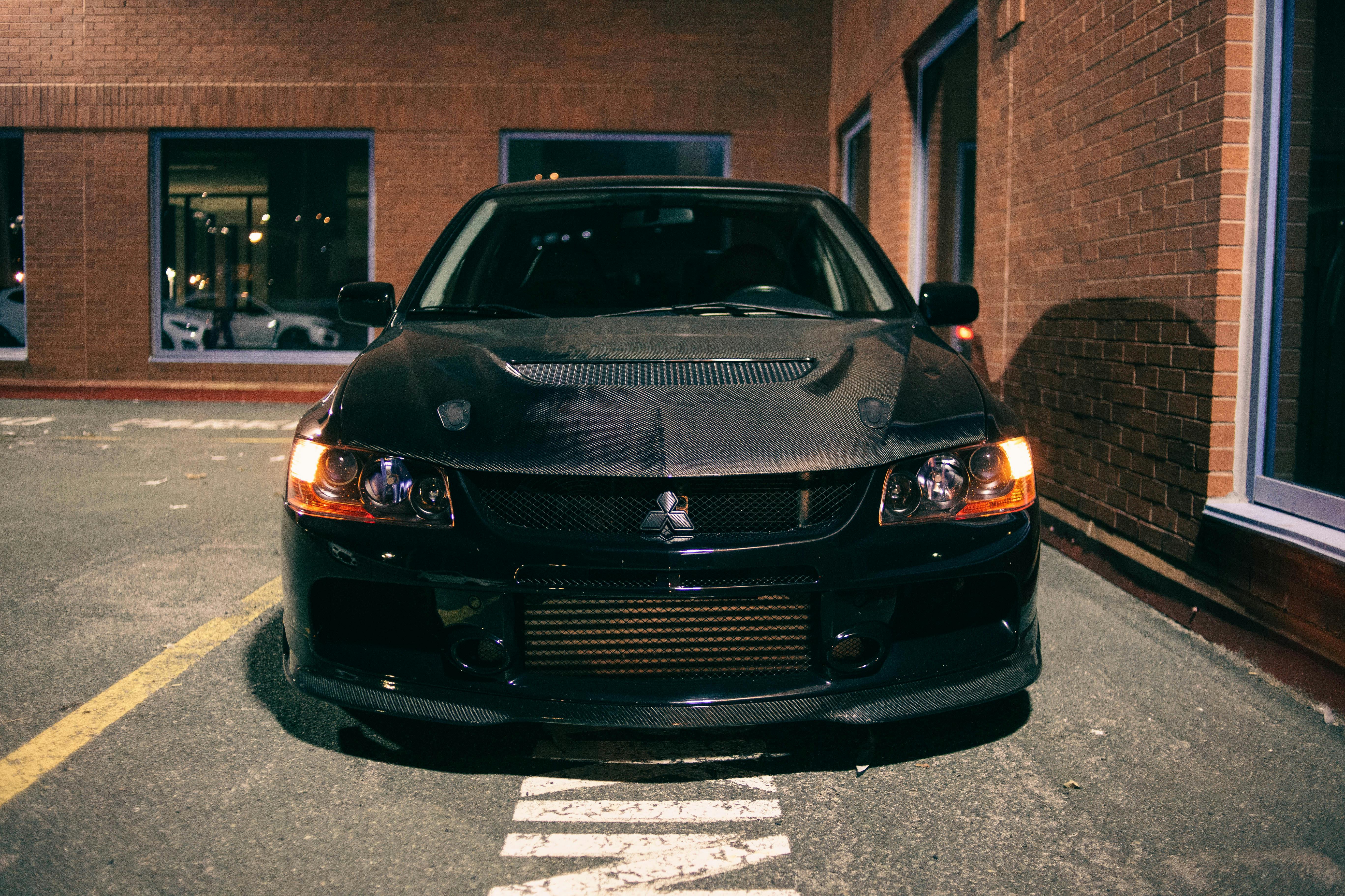 A Black Car on the Parking Lot · Free Stock Photo