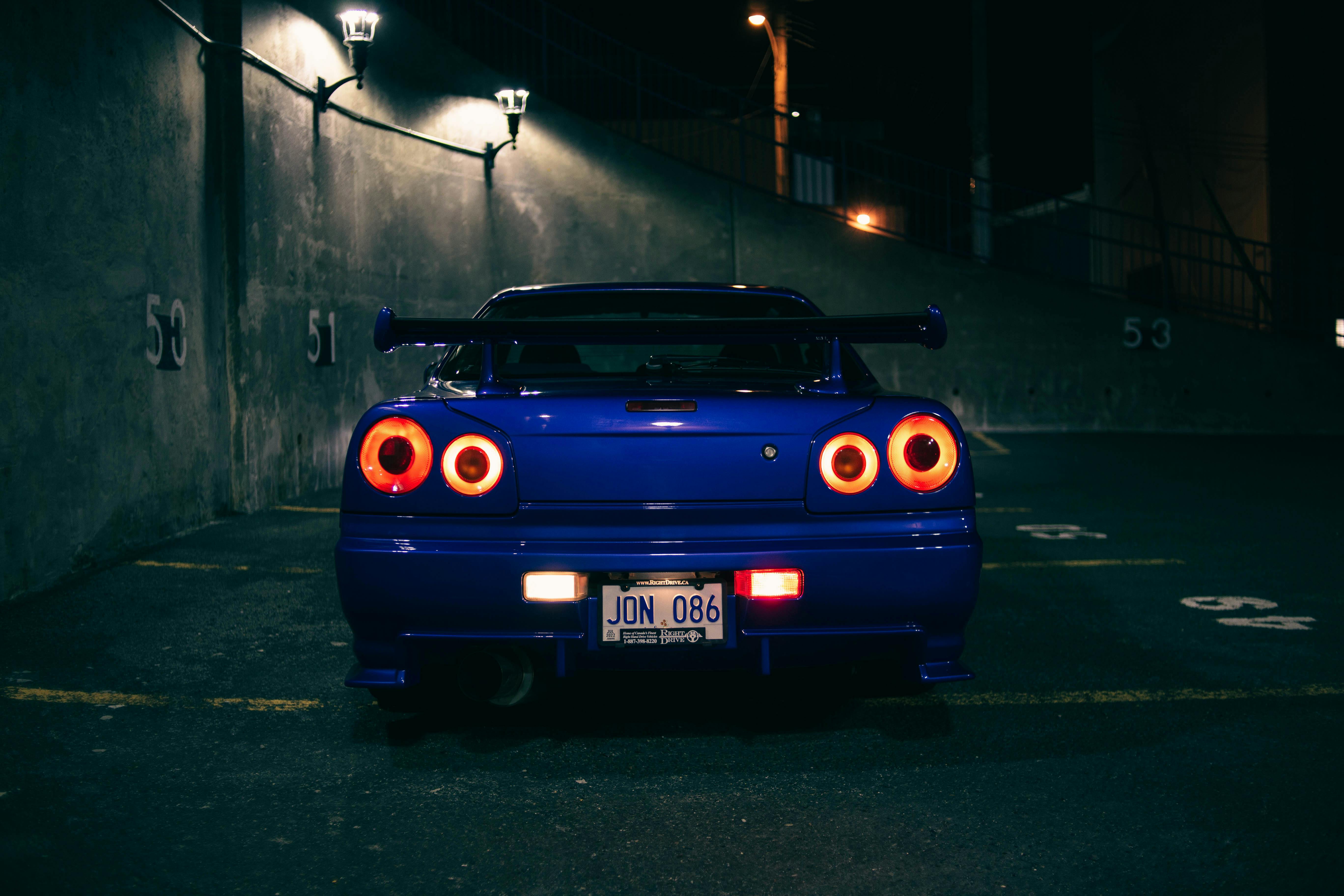 A Blue Sedan Car on the Road · Free Stock Photo