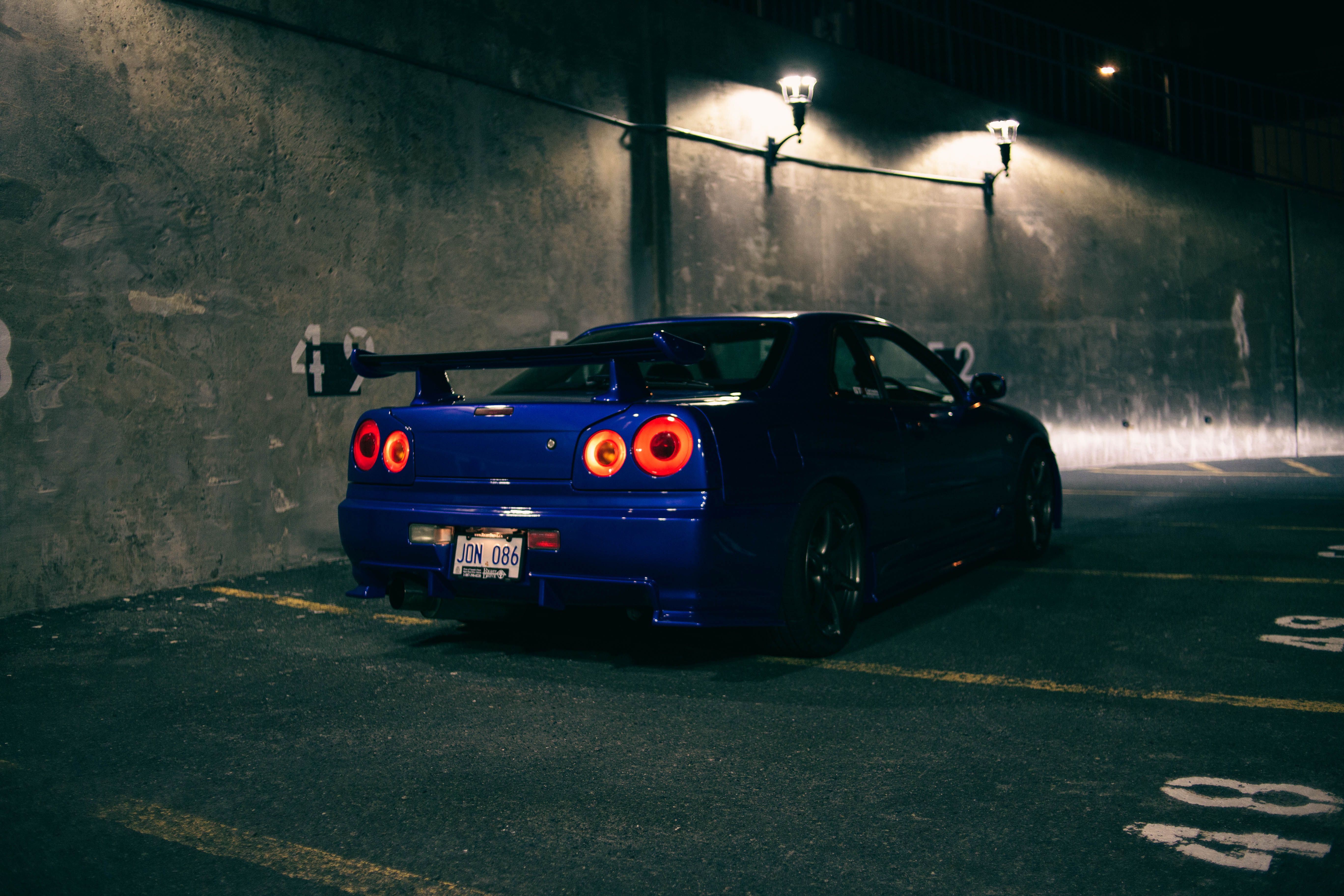 A Blue Sedan Car on the Road · Free Stock Photo