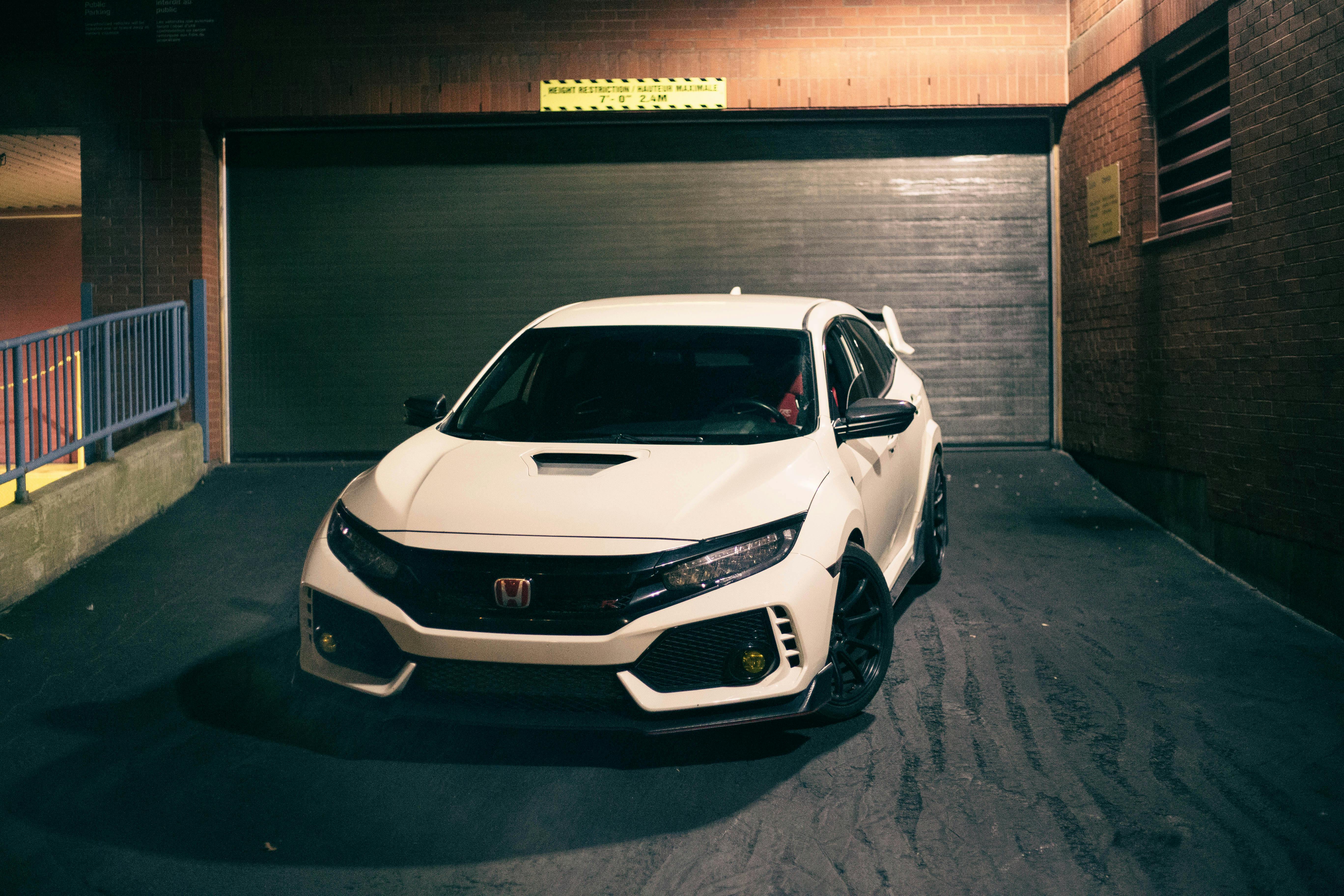 A White Sedan Car on the Road · Free Stock Photo
