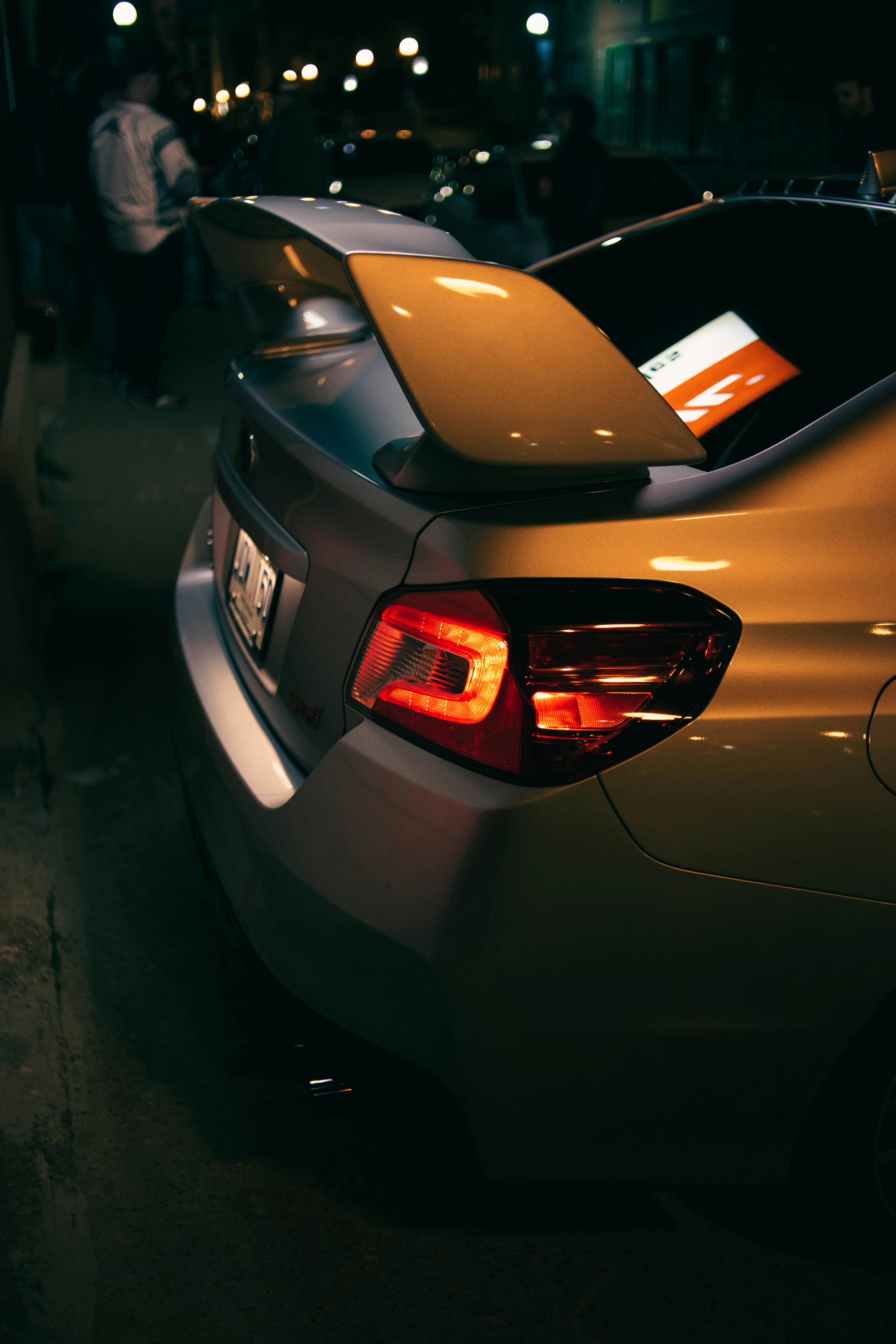 A Red Customized Sports Car with Tilted Wheels · Free Stock Photo