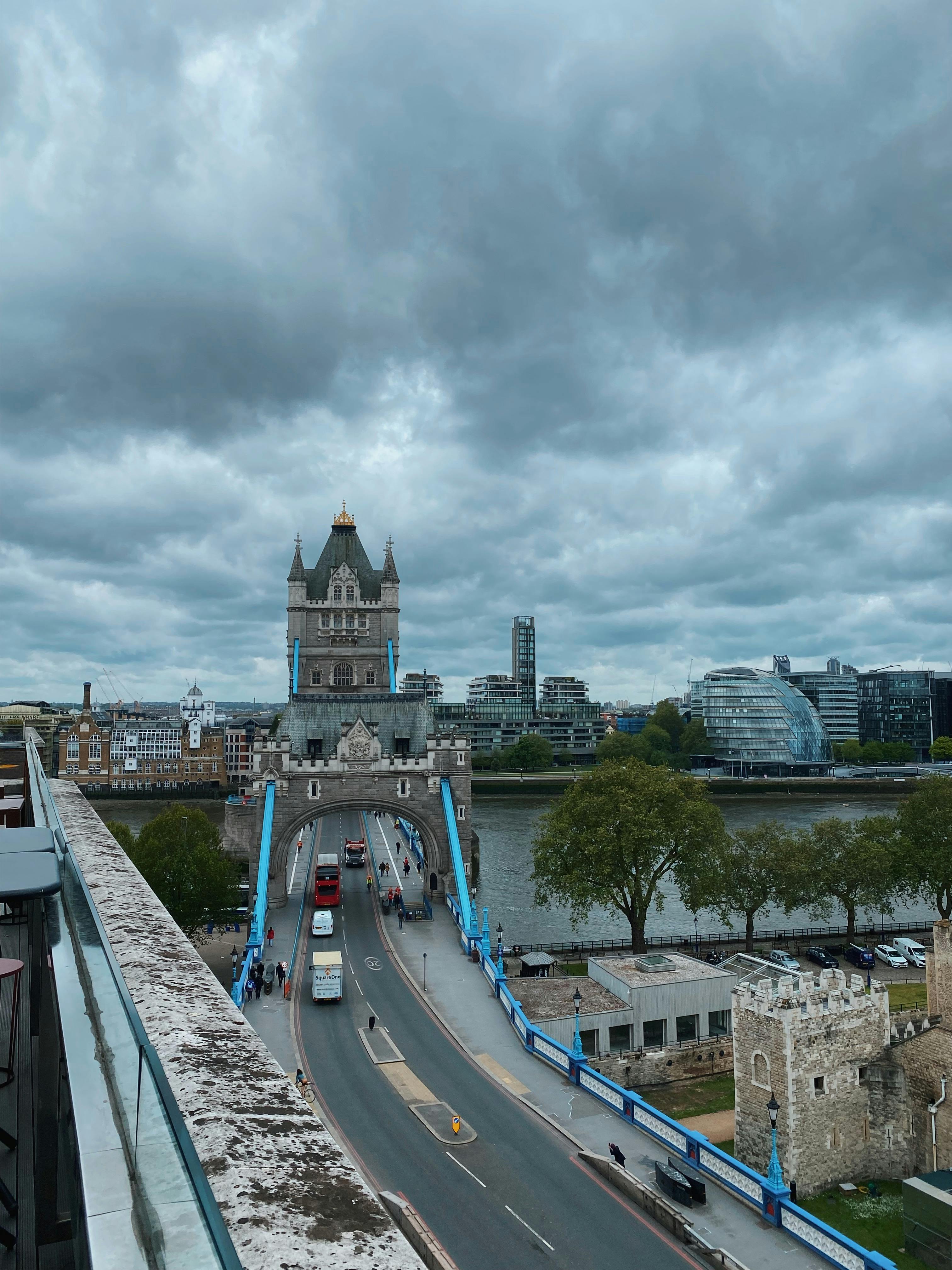 River and Bridge on an Overcast Day · Free Stock Photo