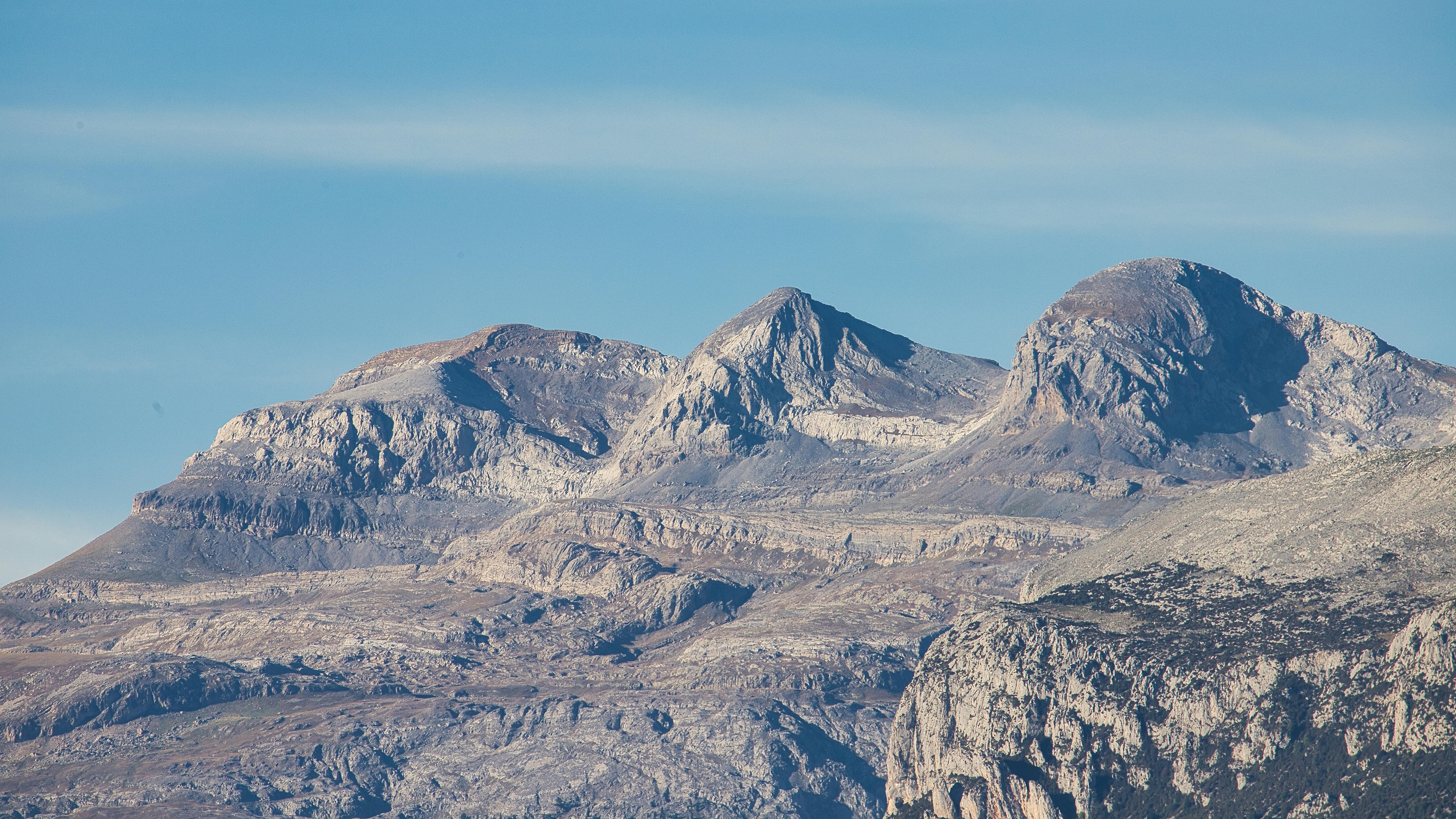 Gray Rock Mountains Under Blue Sky · Free Stock Photo
