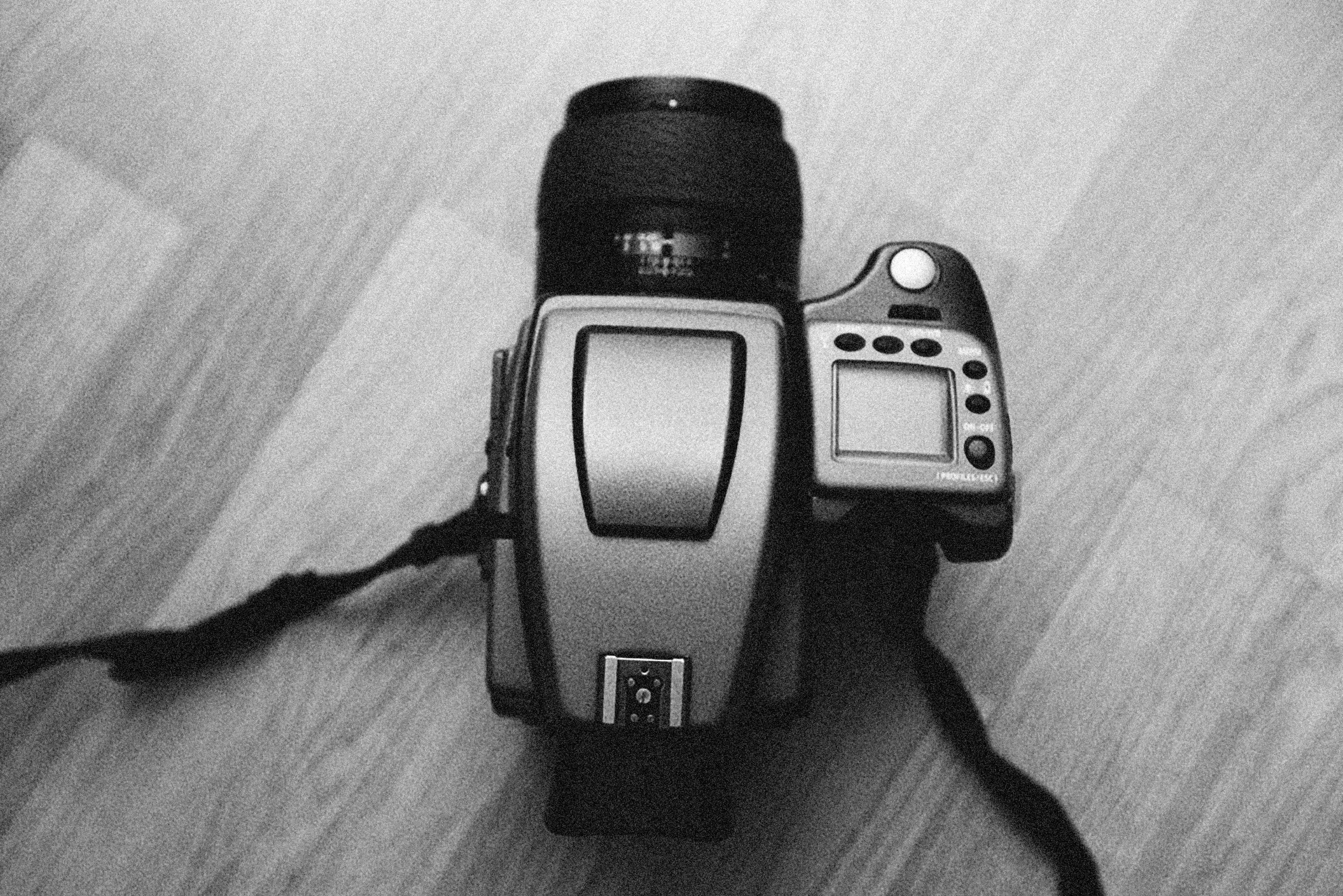 A Grayscale Photography of a Black Video Camera · Free Stock Photo