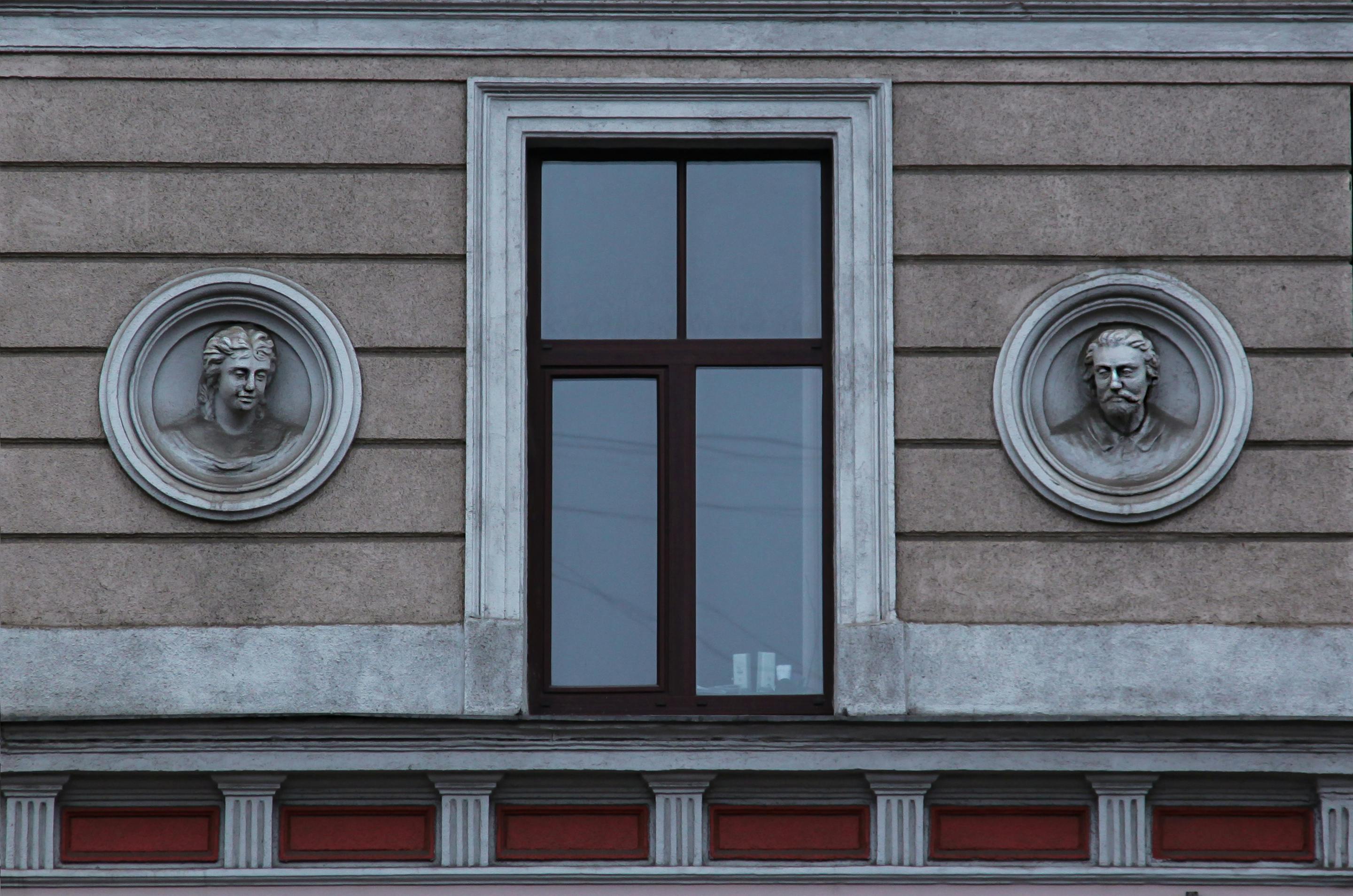 Windows of a Brown Concrete Building · Free Stock Photo