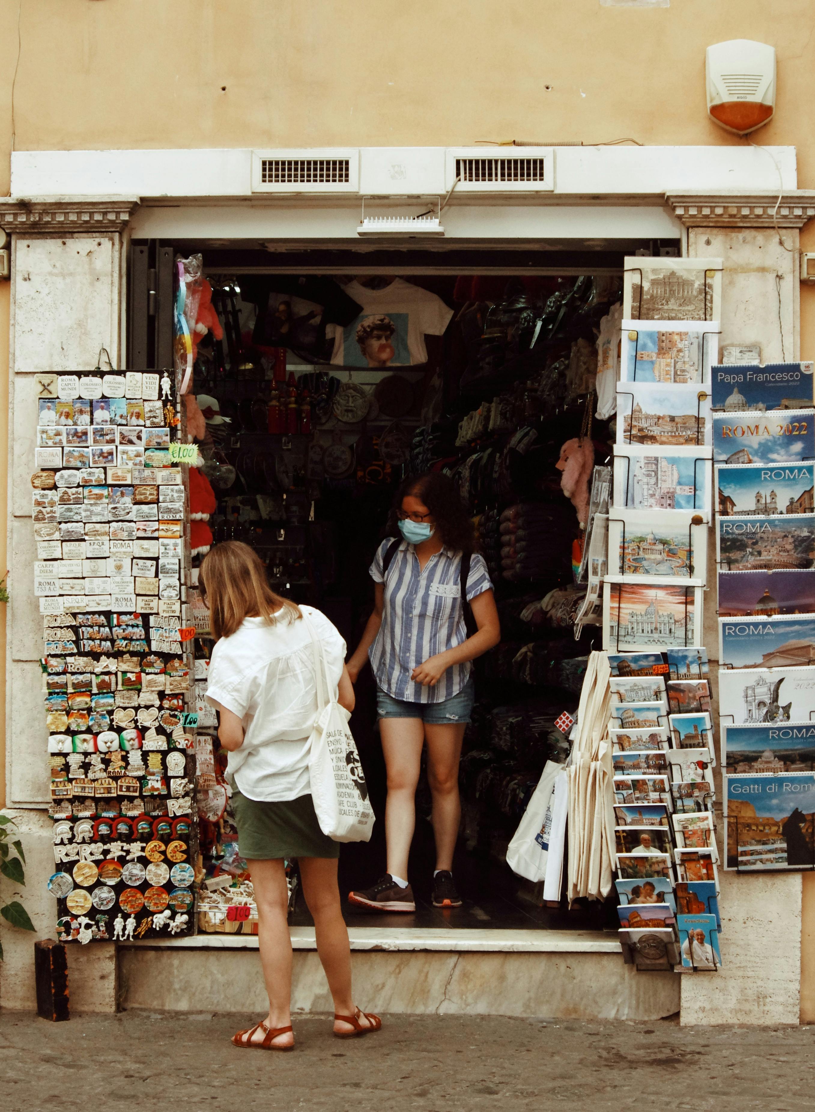 Women in a Postcards and Souvenirs Shop · Free Stock Photo