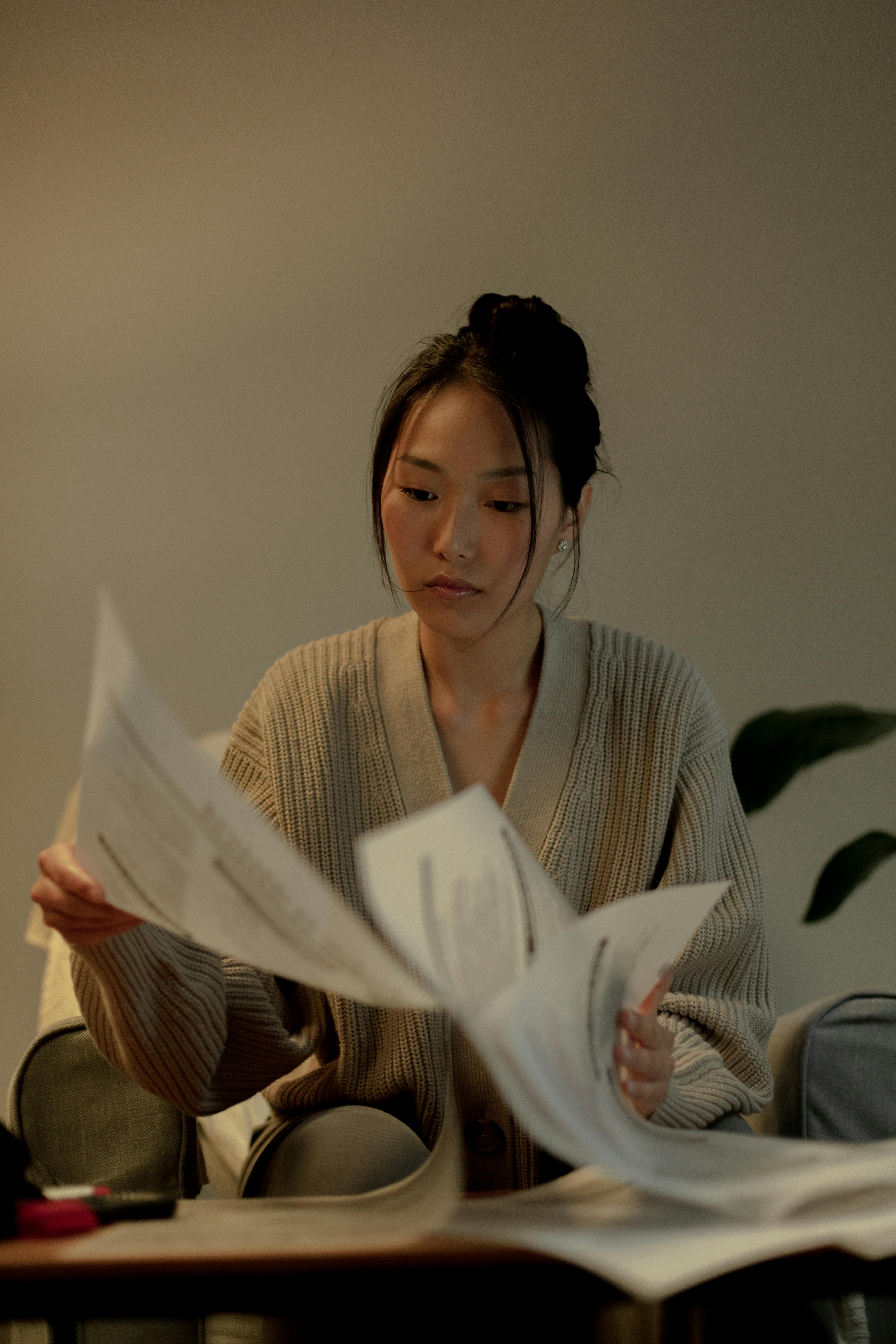 Woman reading papers at home · Free Stock Photo