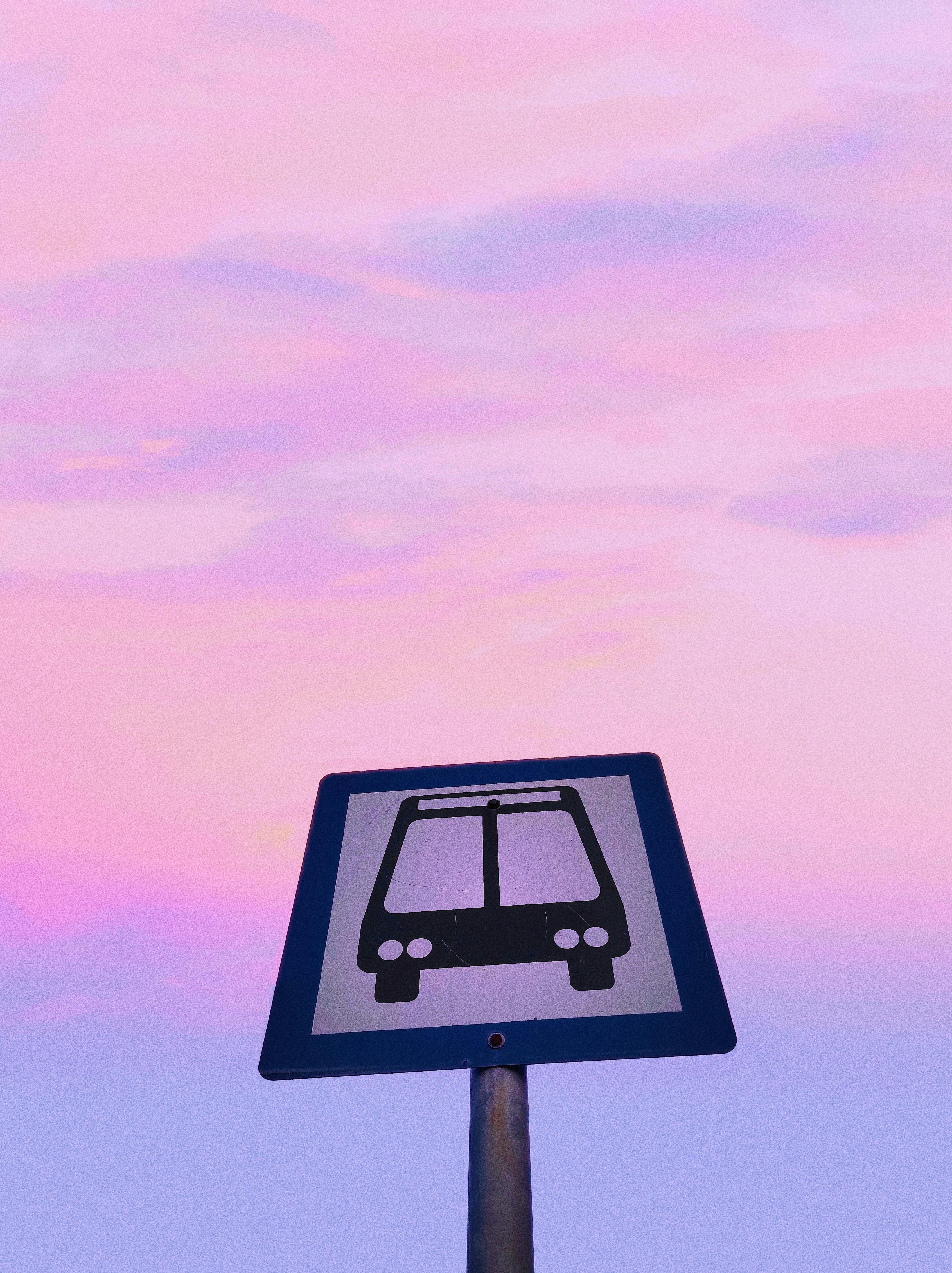 Road Sign and a Sunset Sky · Free Stock Photo