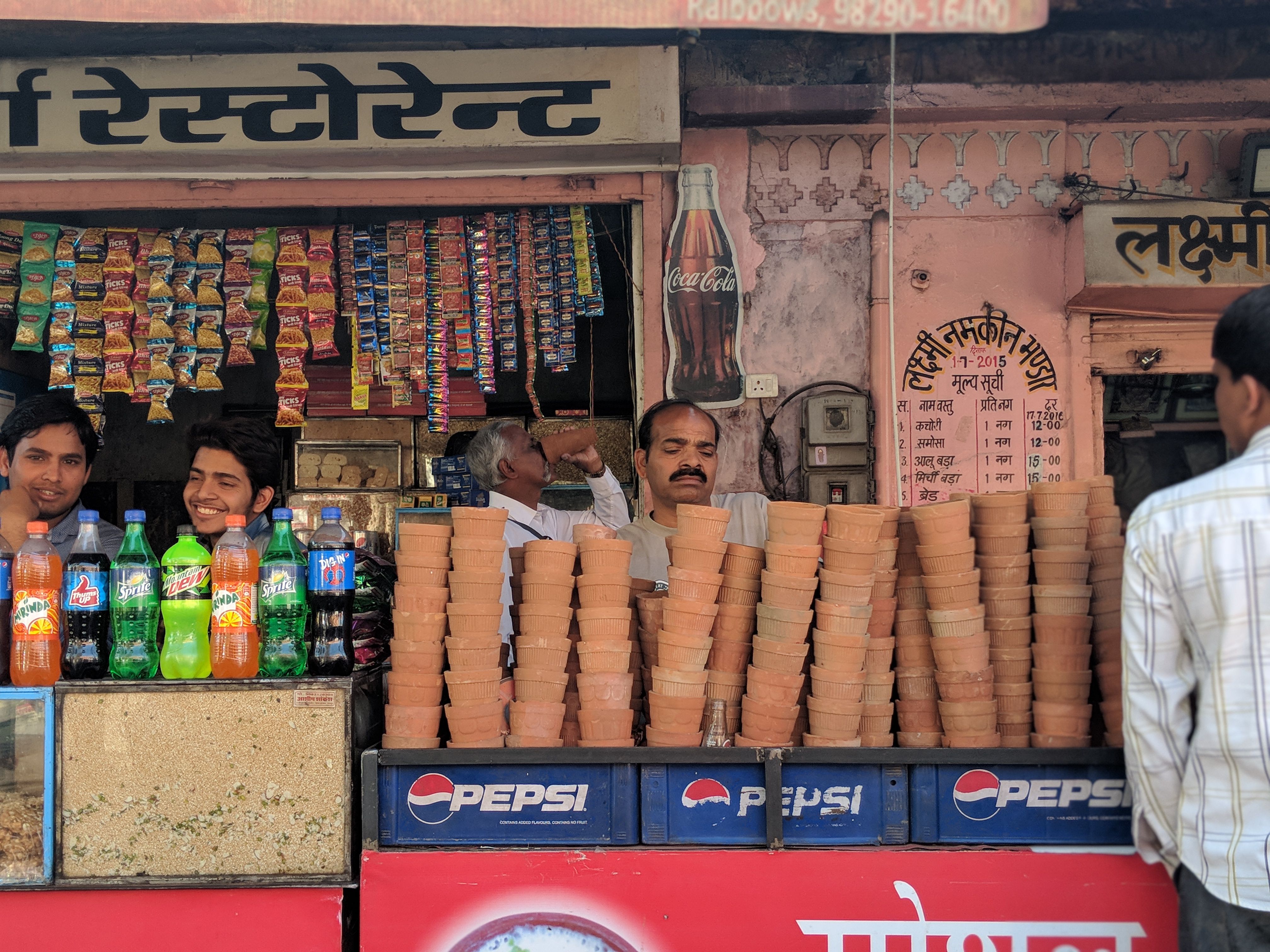 Person Selling Brown Clay Pots · Free Stock Photo