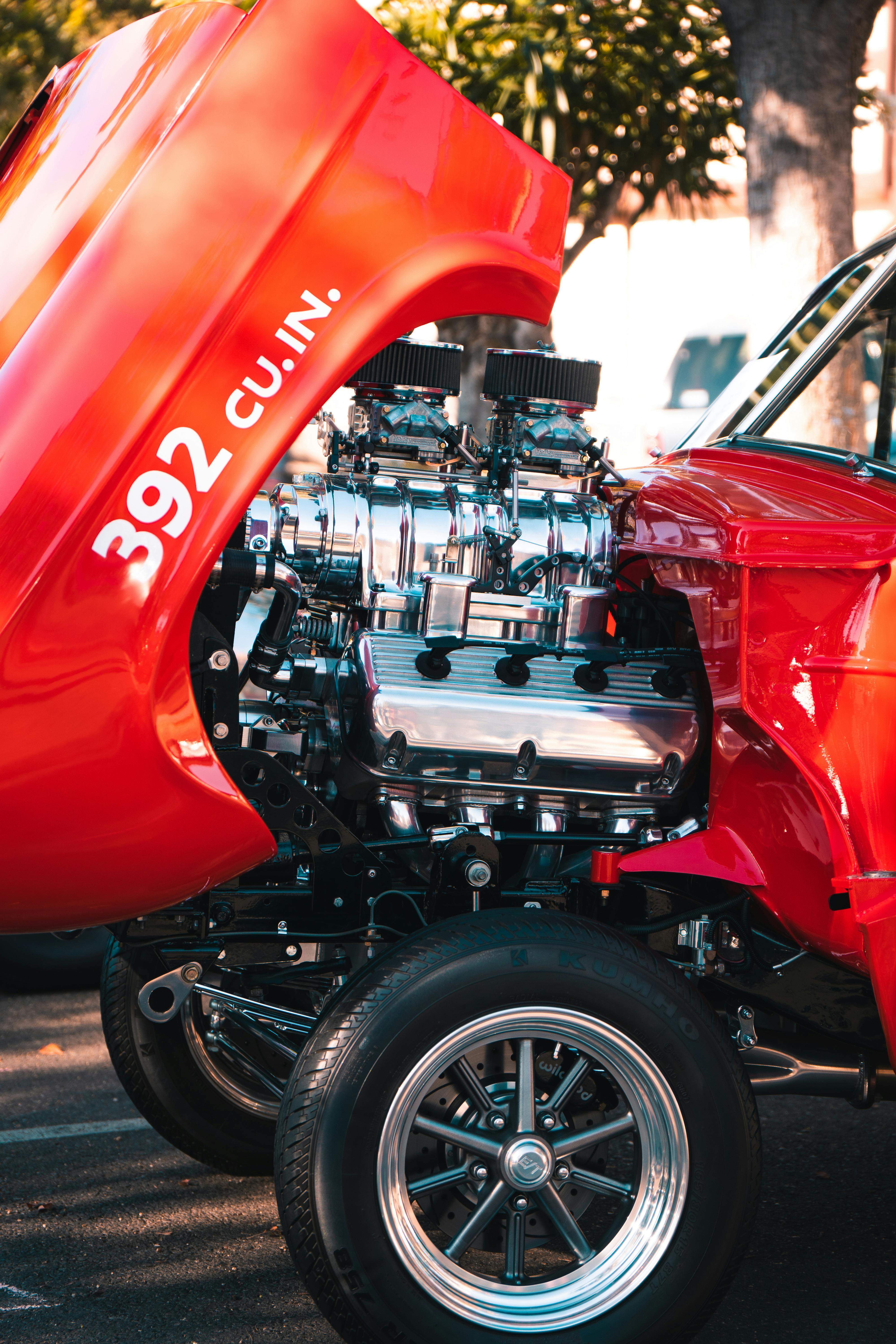 Red Car with Opened Hood Revealing the Engine · Free Stock Photo
