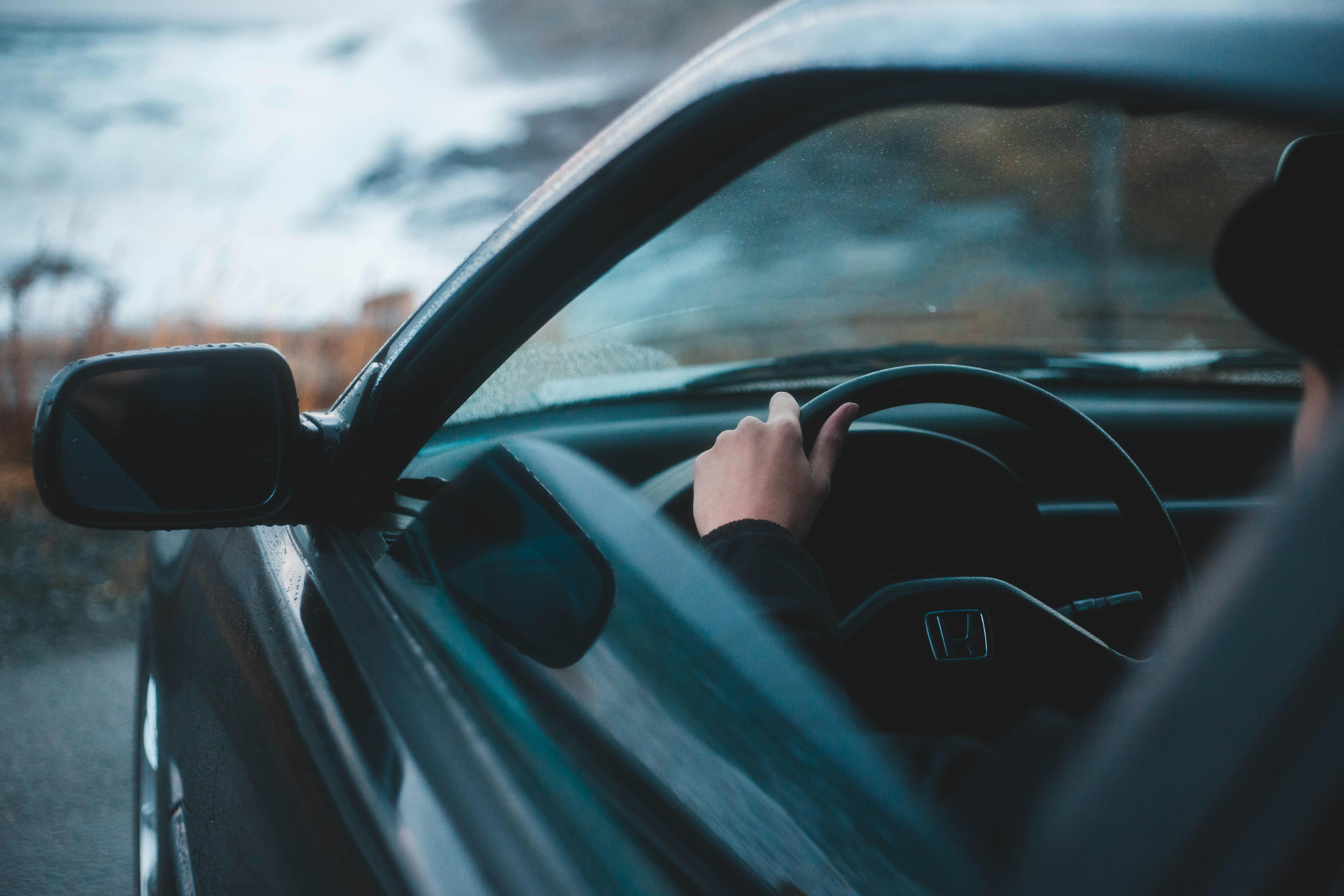 Man Sitting On Car Hood · Free Stock Photo