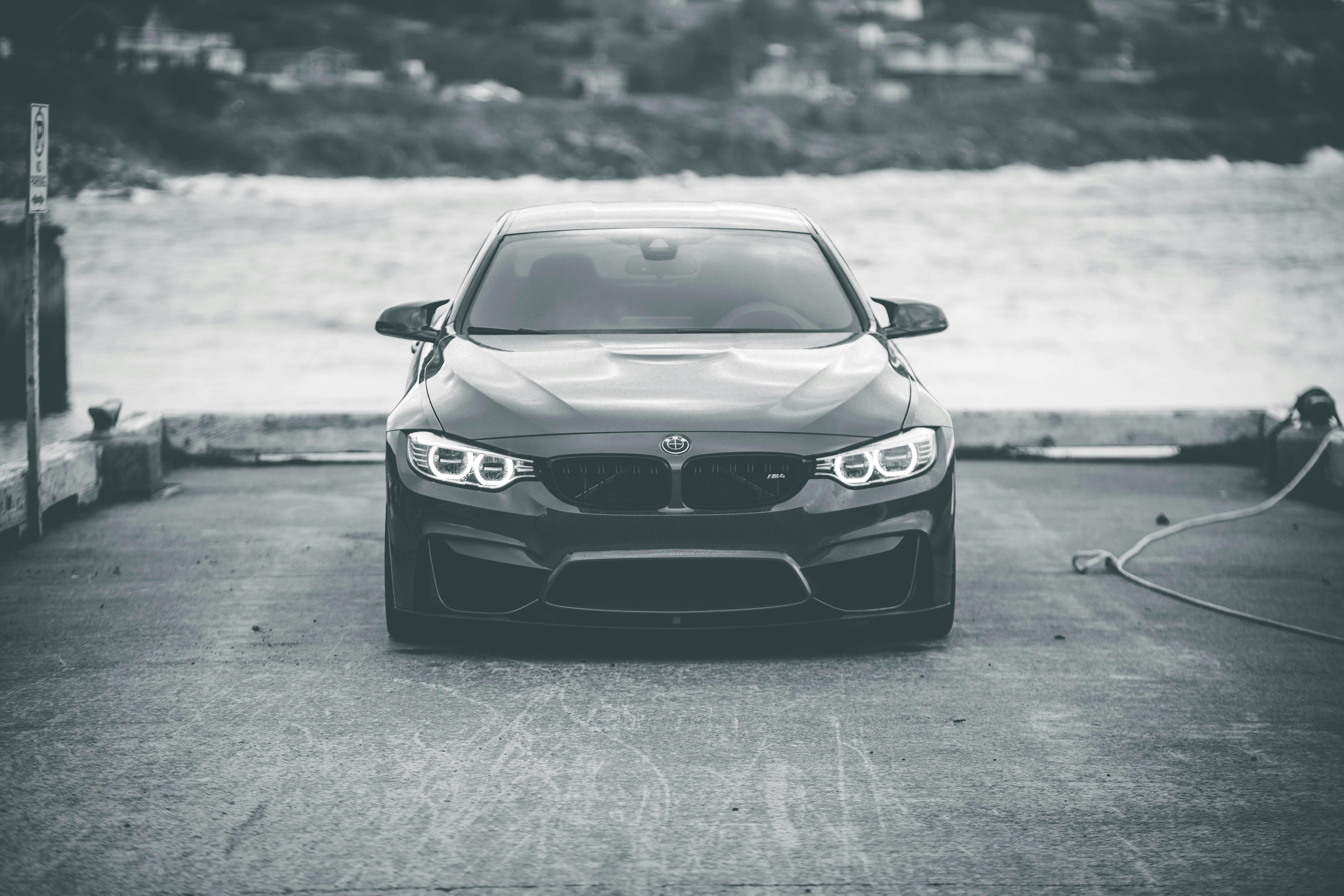 Grayscale Photo of an Expensive Car · Free Stock Photo