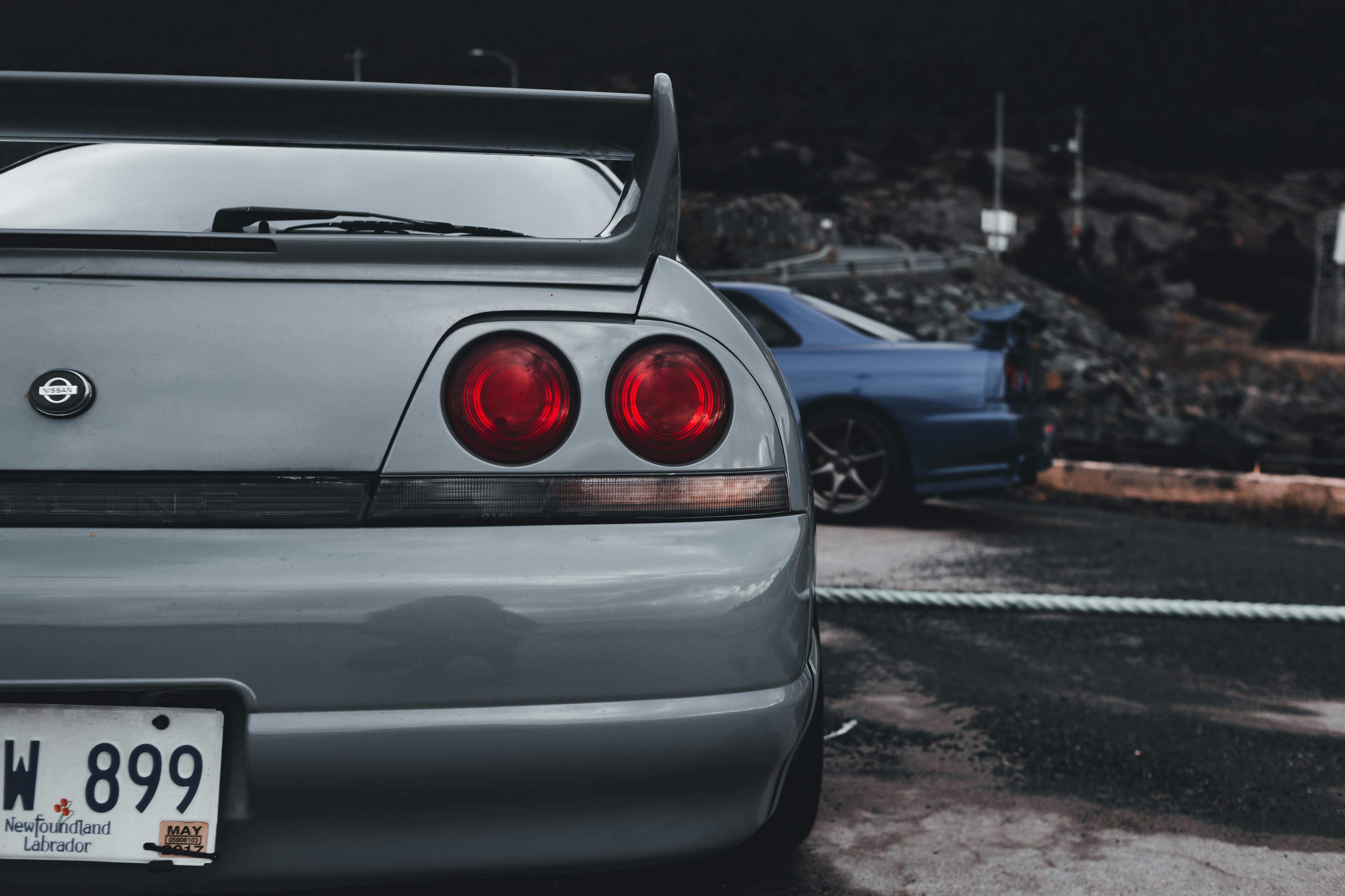 Red Nissan Vehicle Running on Sand Dune · Free Stock Photo