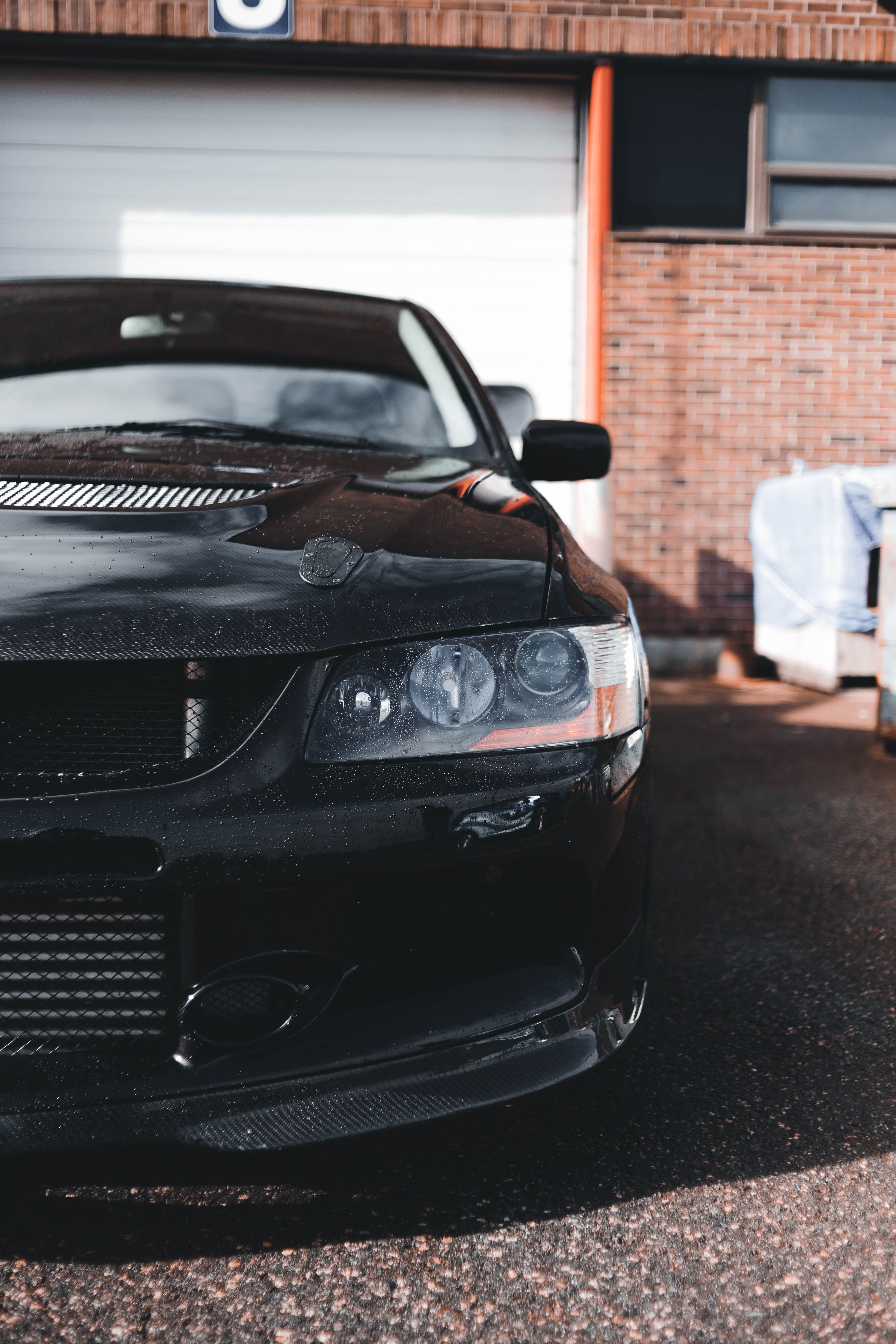 Car with Headlights on · Free Stock Photo