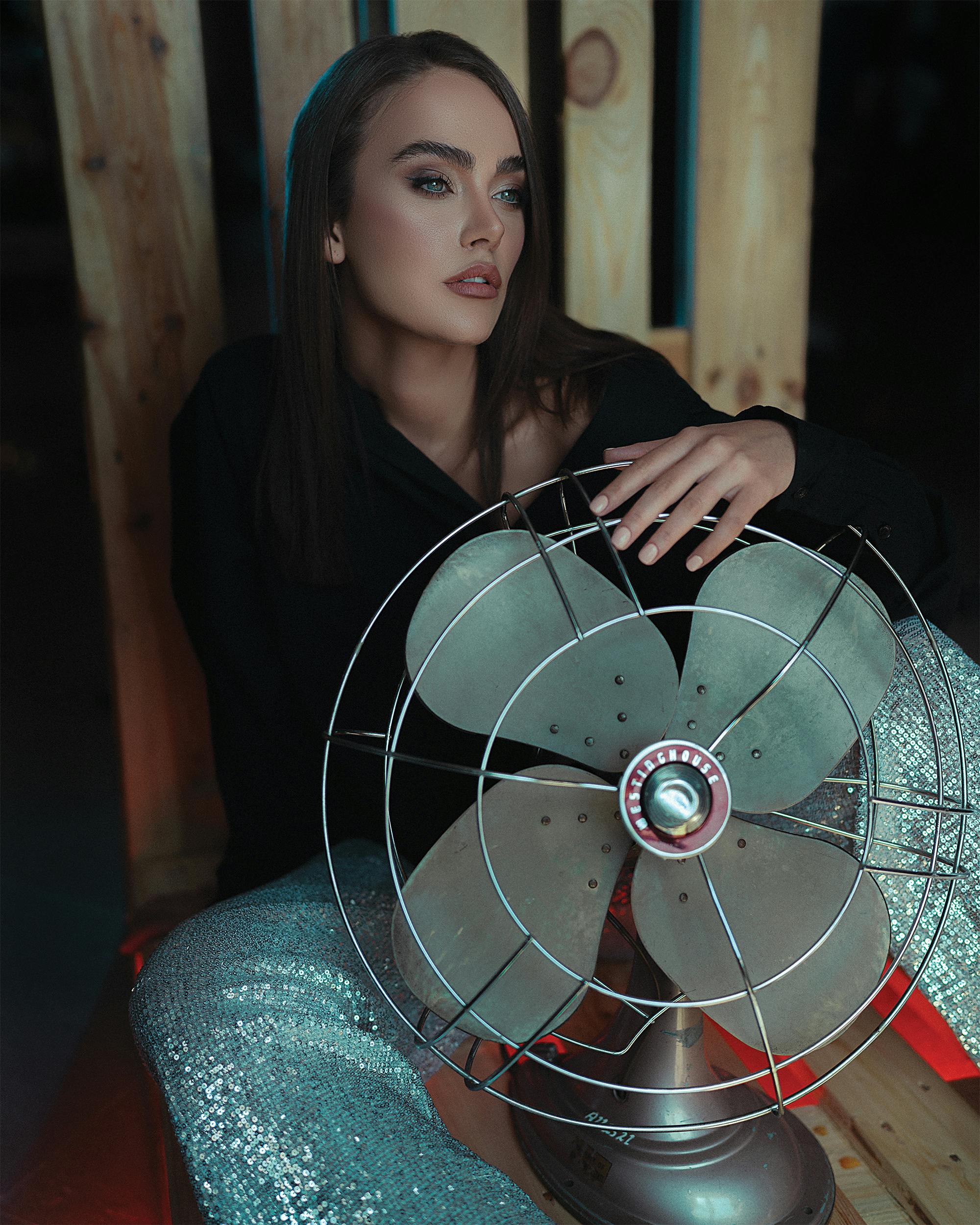 A Woman Holding a Fan · Free Stock Photo