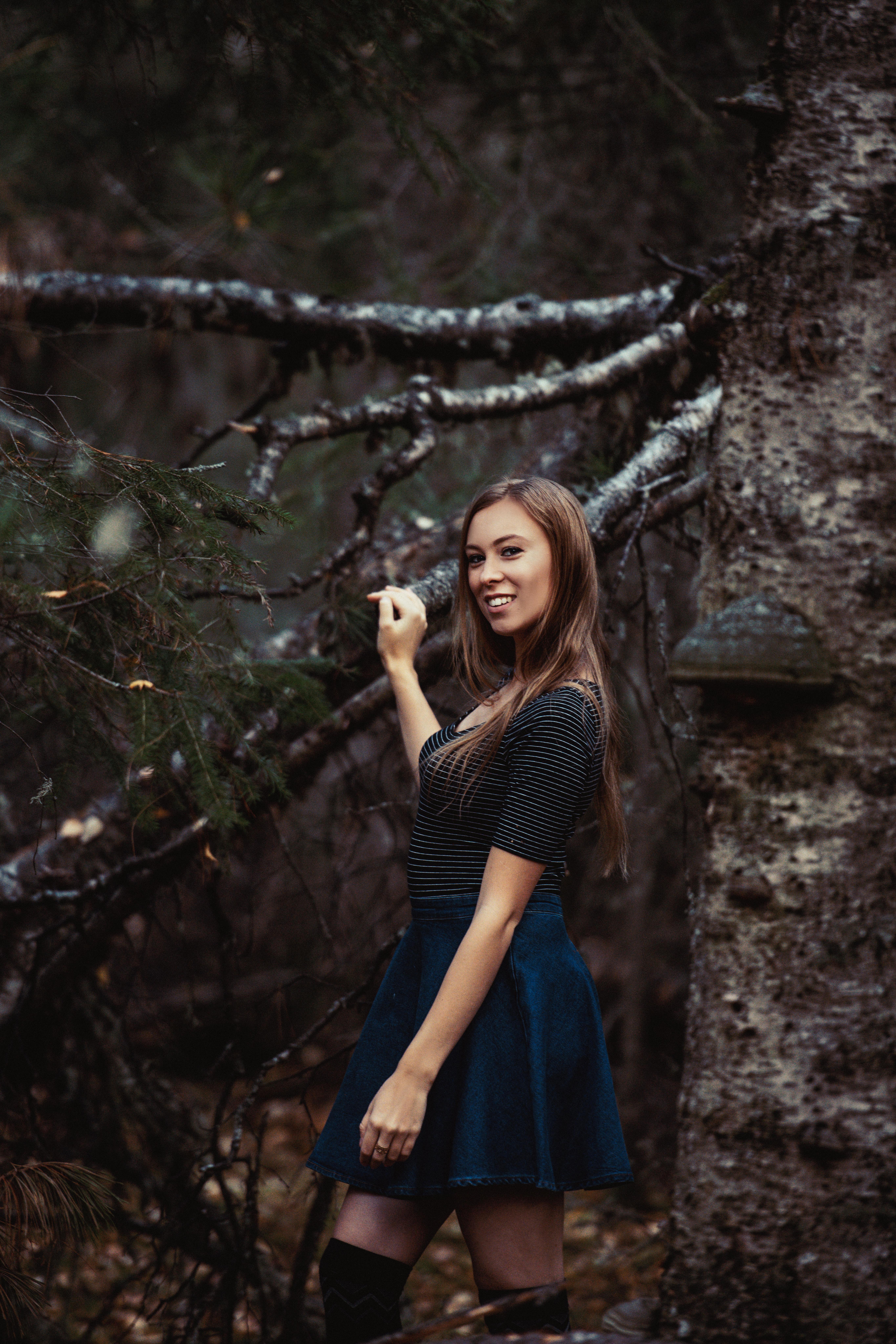Woman Posing near Tree Branches · Free Stock Photo