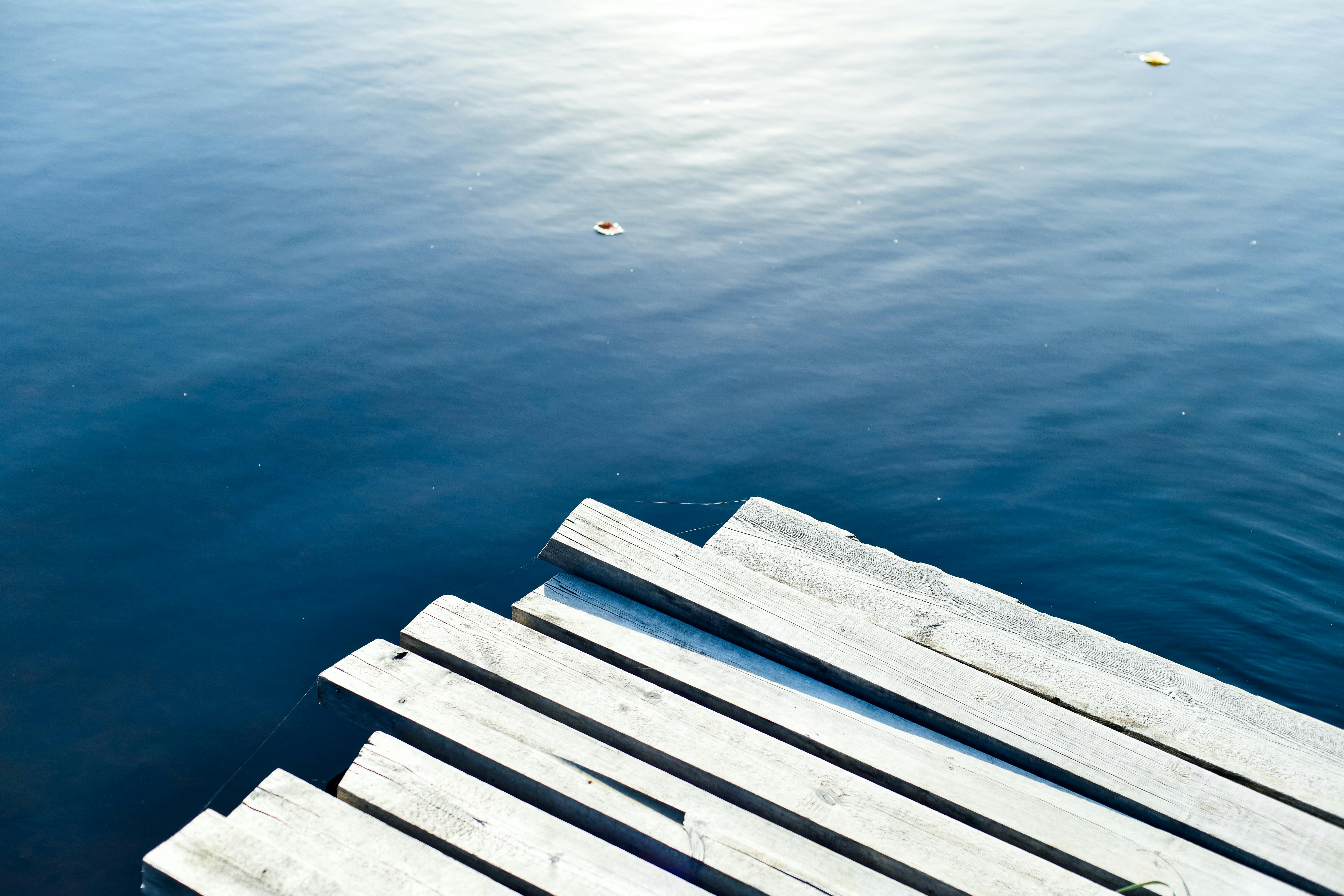 Wooden Planks near Body of Water · Free Stock Photo
