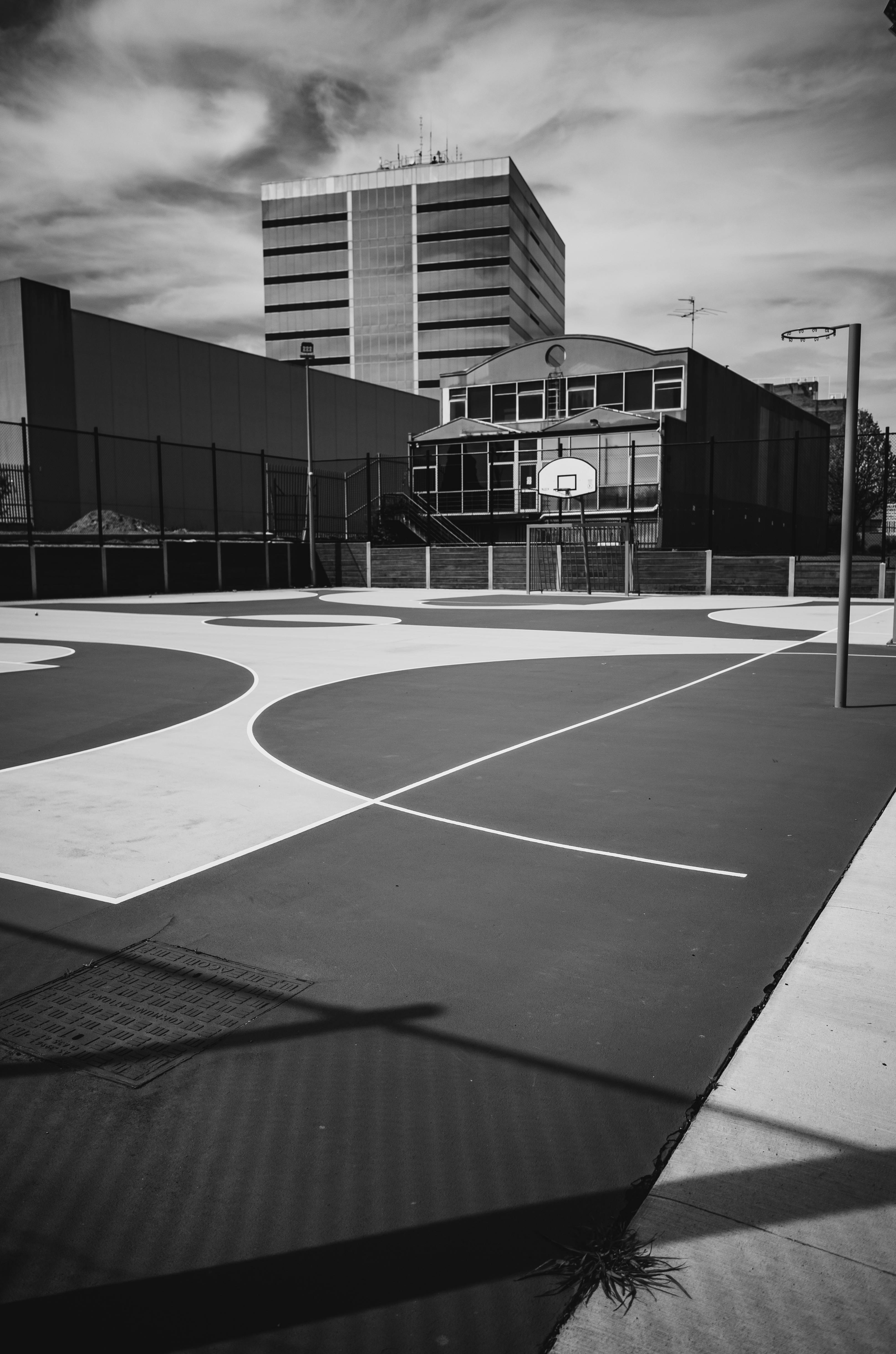Grayscale Photo of Basketball Court · Free Stock Photo