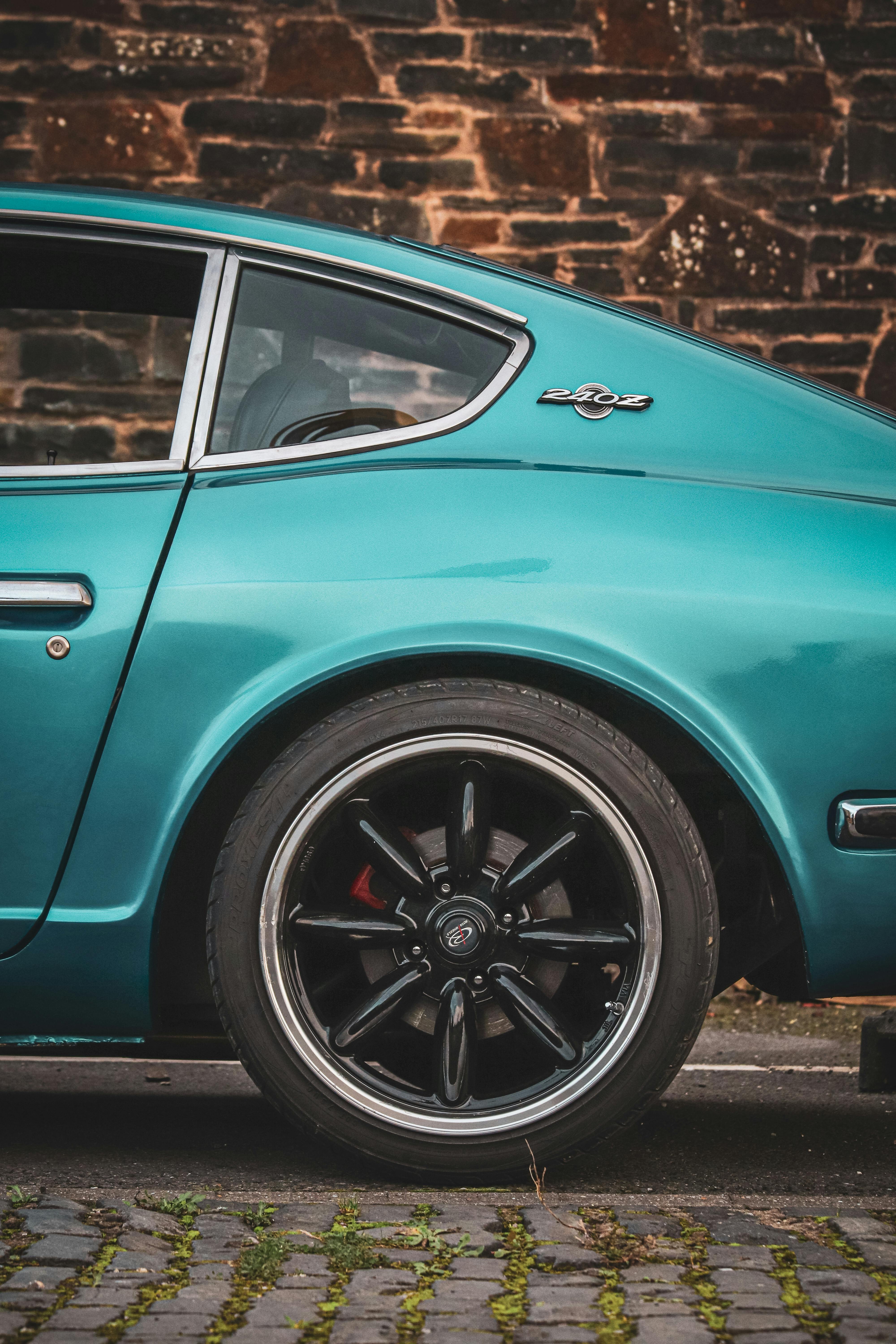 Teal Car Parked on the Street · Free Stock Photo