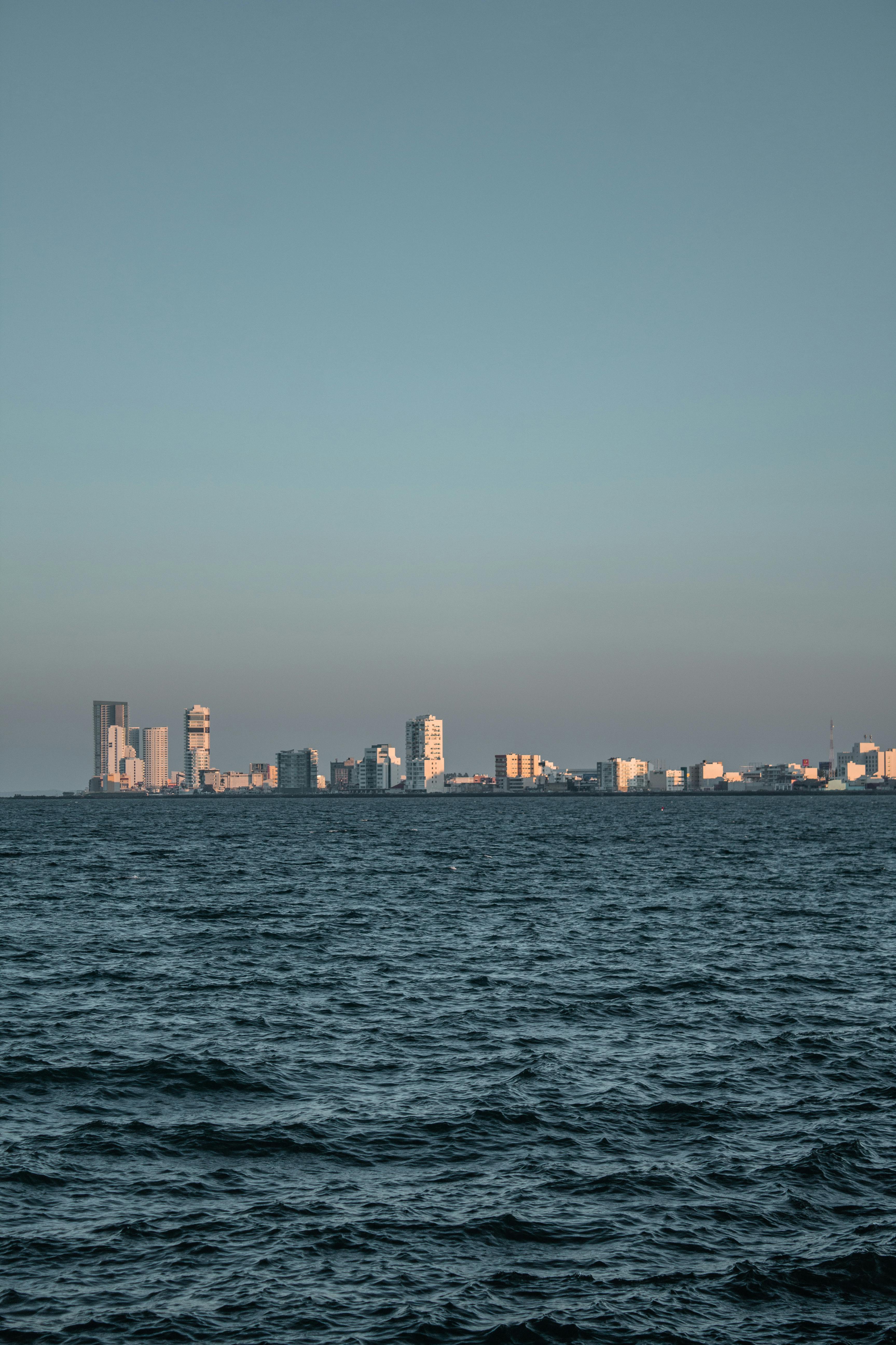 High Rise Buildings Near Sea · Free Stock Photo