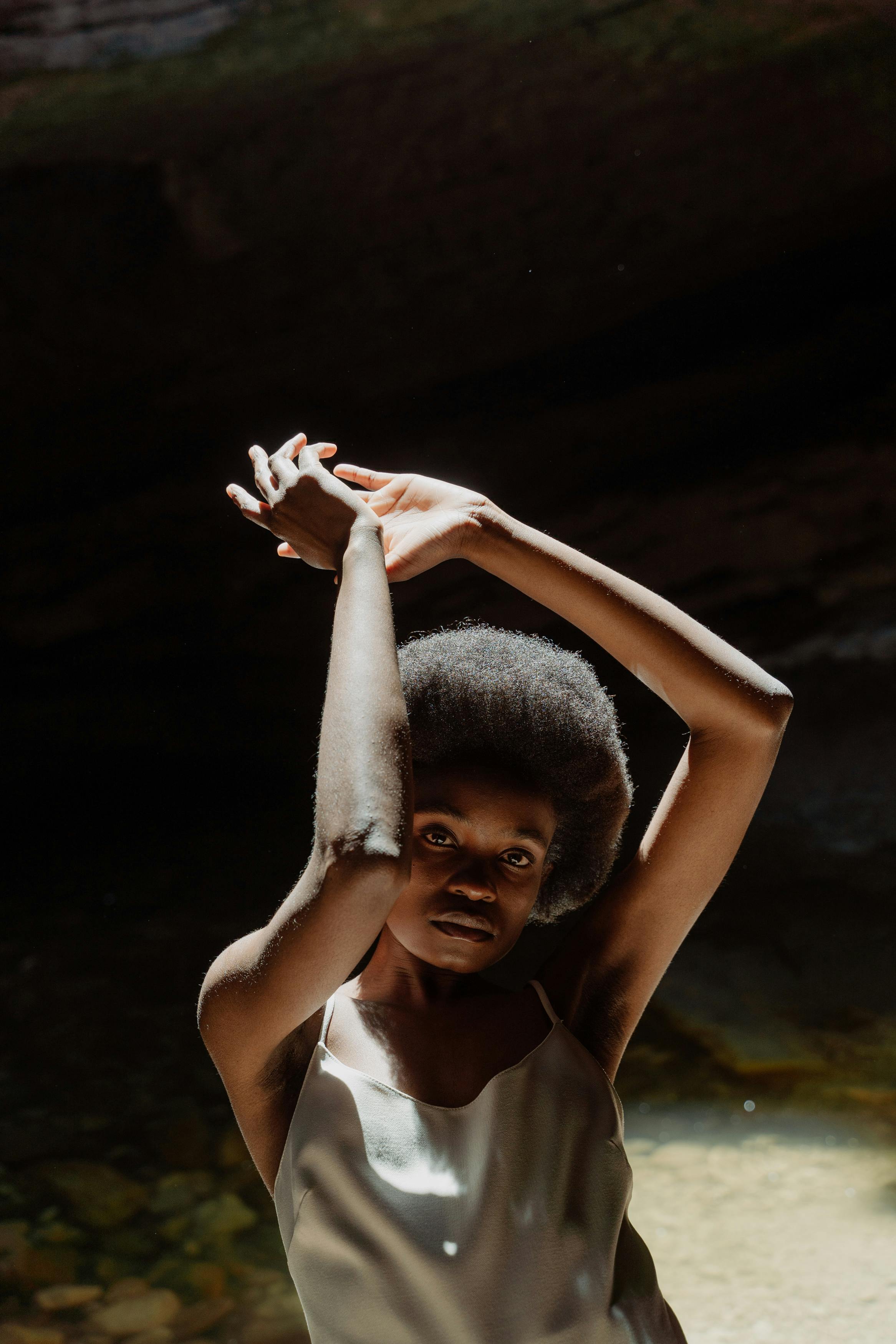 Beautiful Woman with her Arms Raised · Free Stock Photo