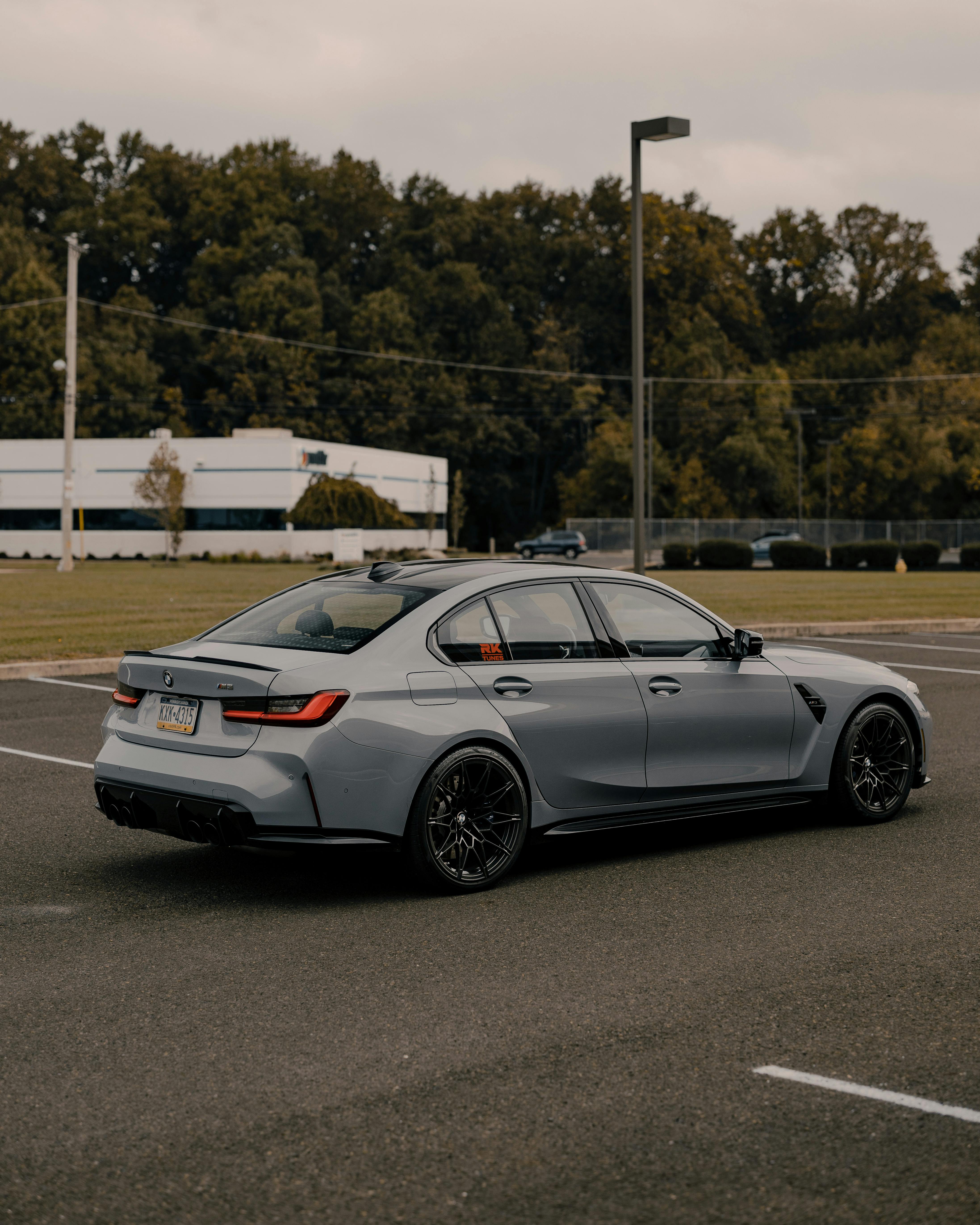 Gray Car on Gray Asphalt Road · Free Stock Photo