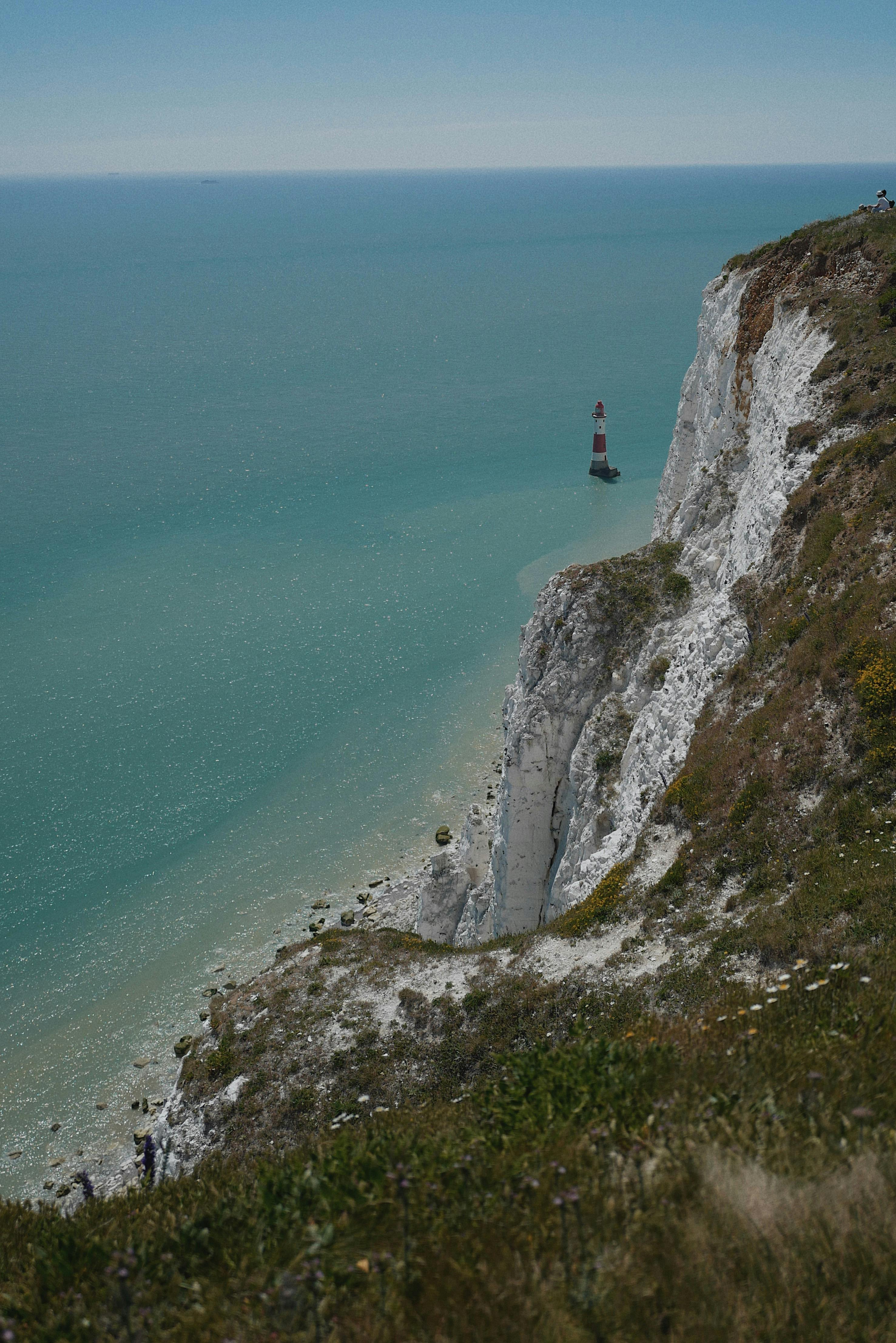Aerial Photo of Lighthouse at Top of Cliff · Free Stock Photo