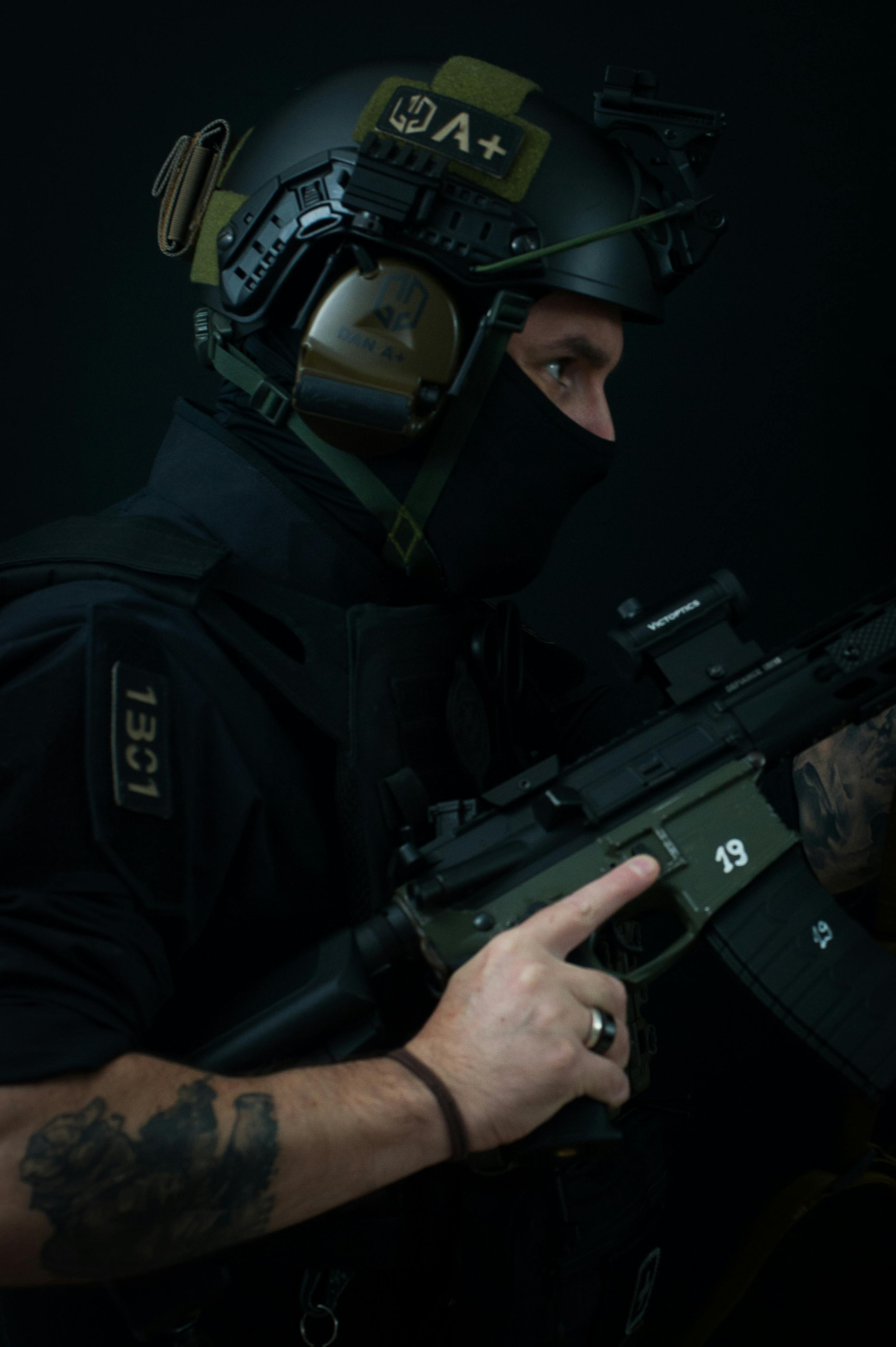 Man wearing Helmet Holding Rifle · Free Stock Photo