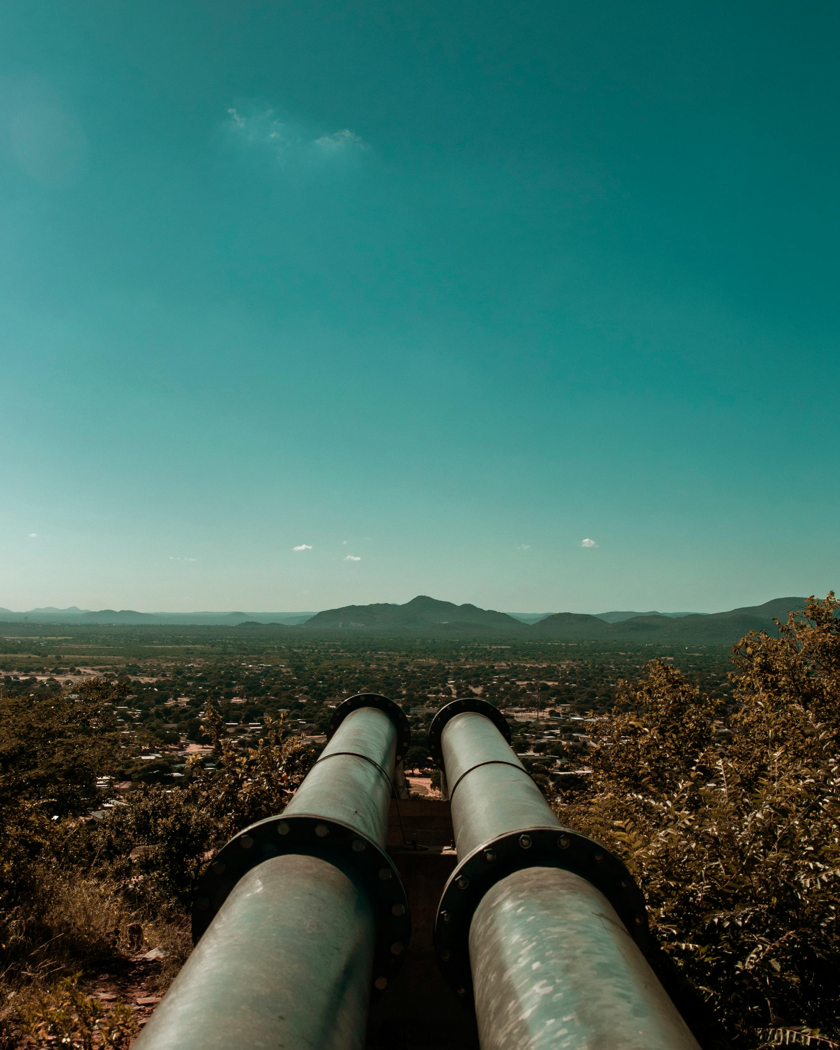 Clear Sky over Pipes over Town · Free Stock Photo