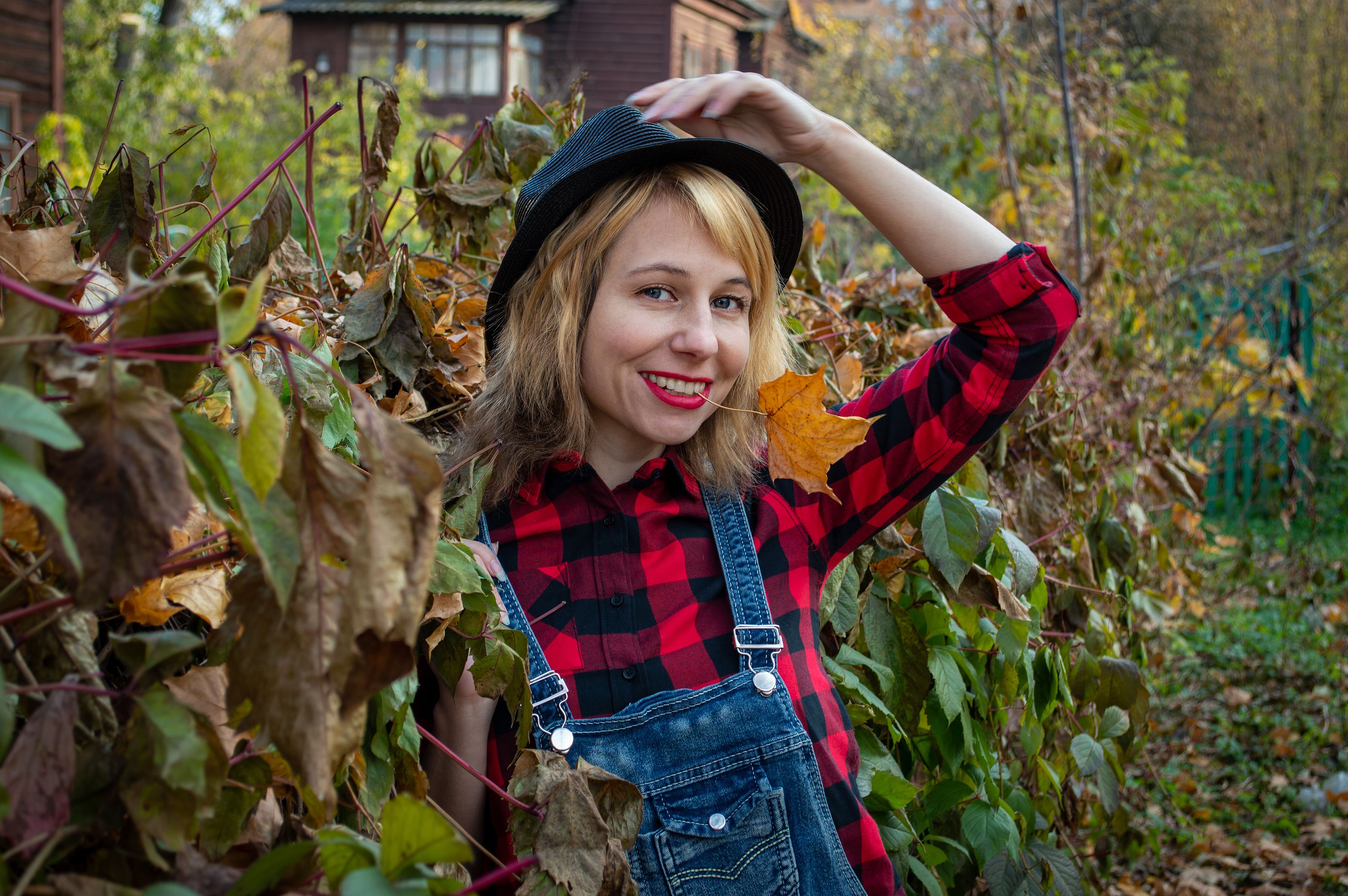 Smiling Woman among Bushes · Free Stock Photo