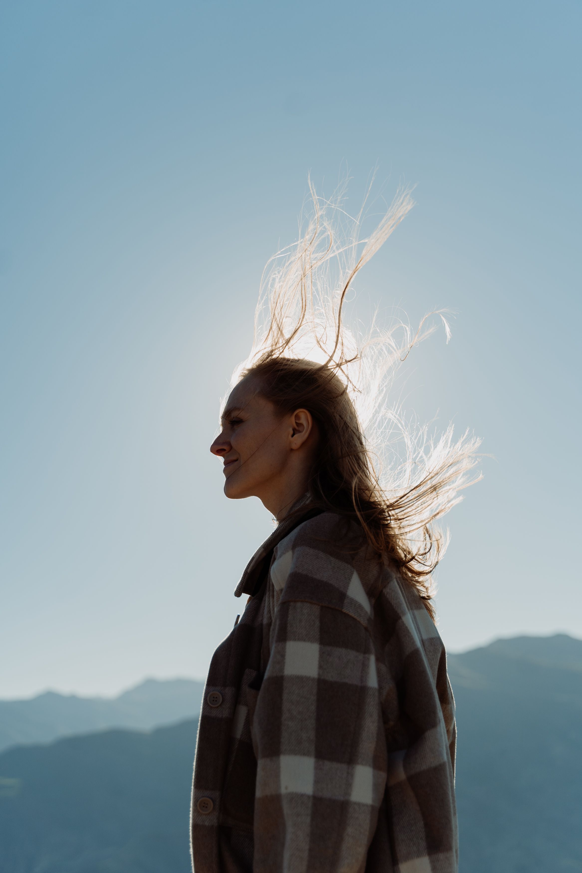 Side View of Woman in Plaid Jacket · Free Stock Photo