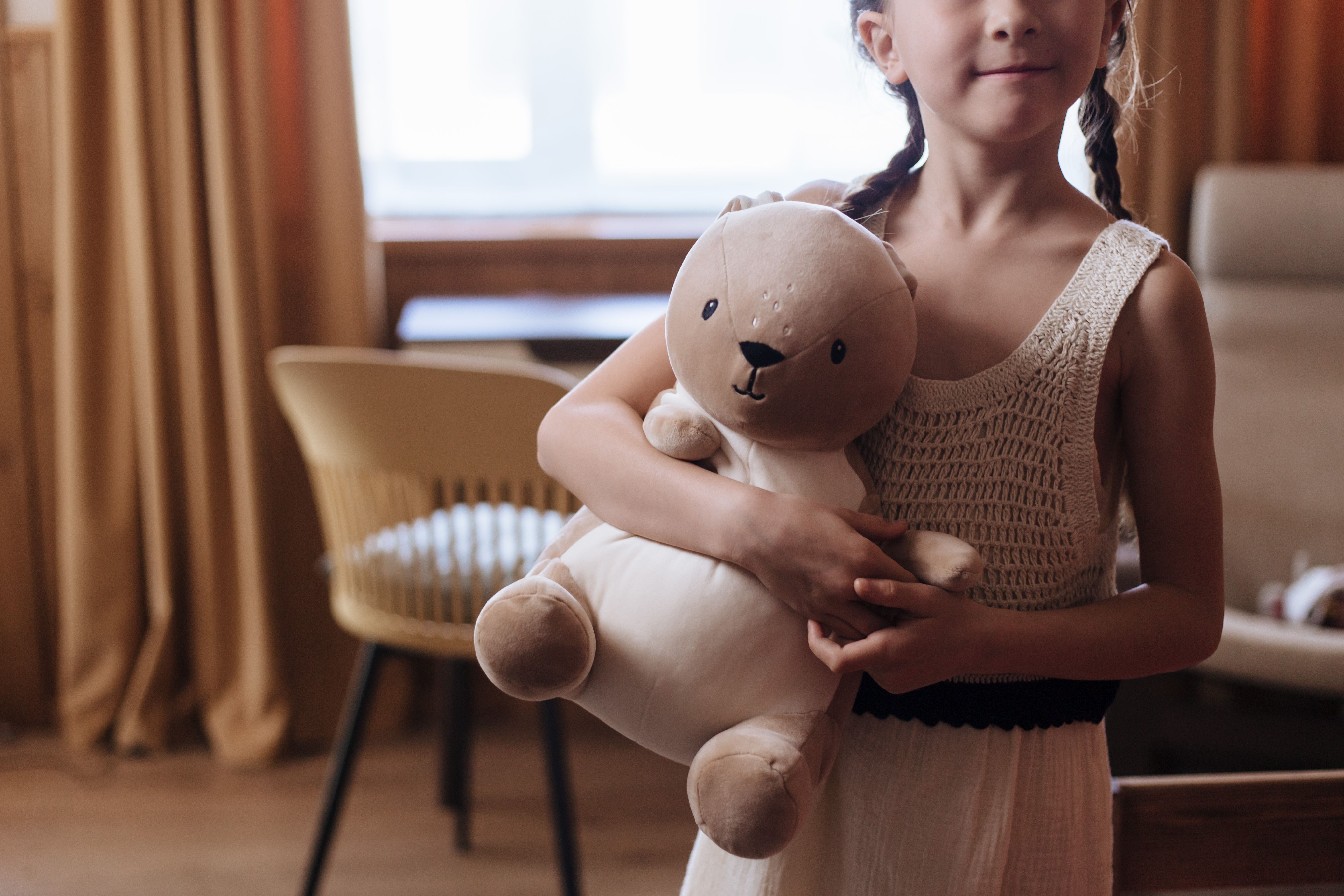 A Little Girl Hugging a Stuffed Toy · Free Stock Photo
