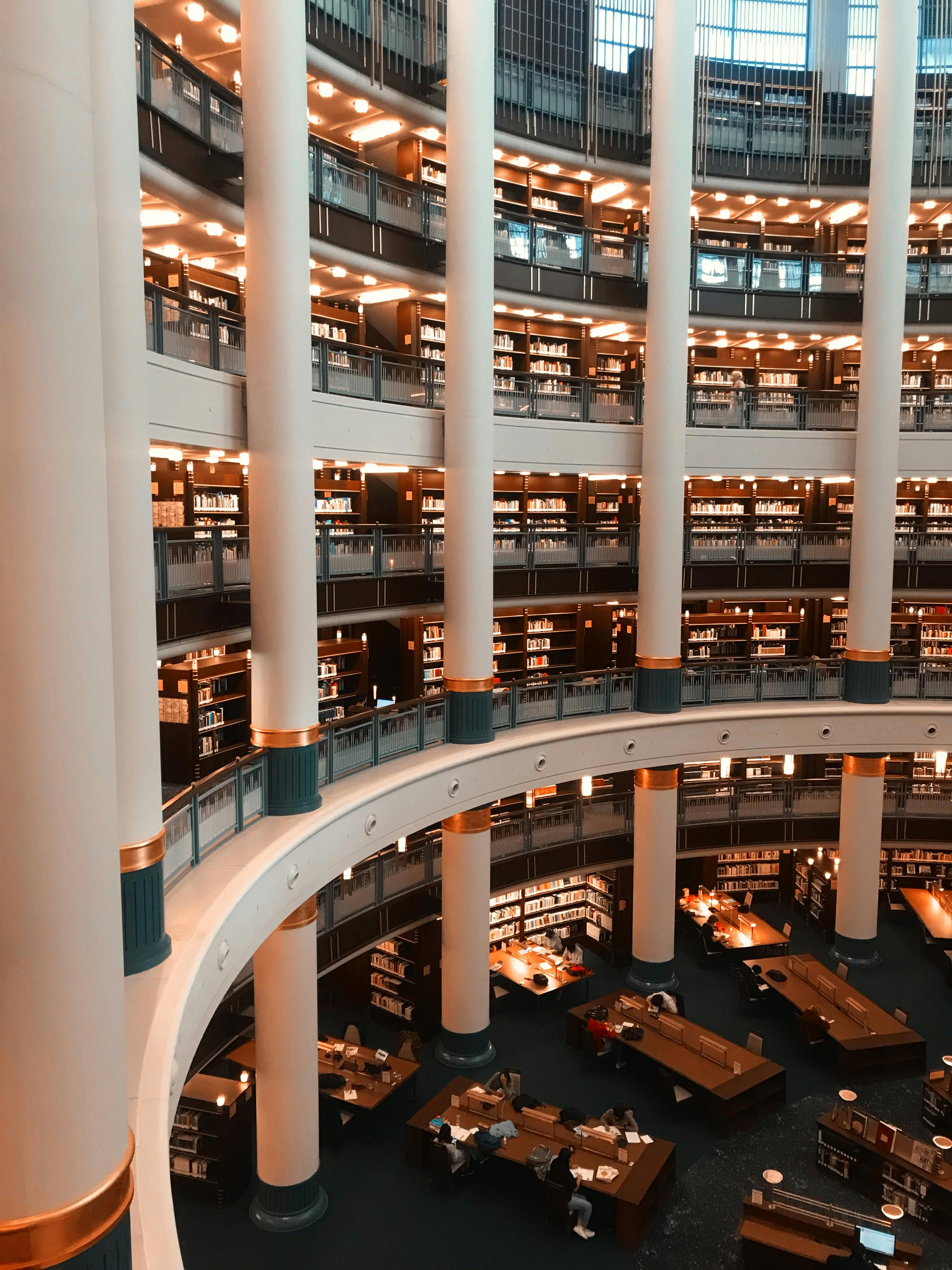 Circular Library Interior with Bookshelves and Columns · Free Stock Photo