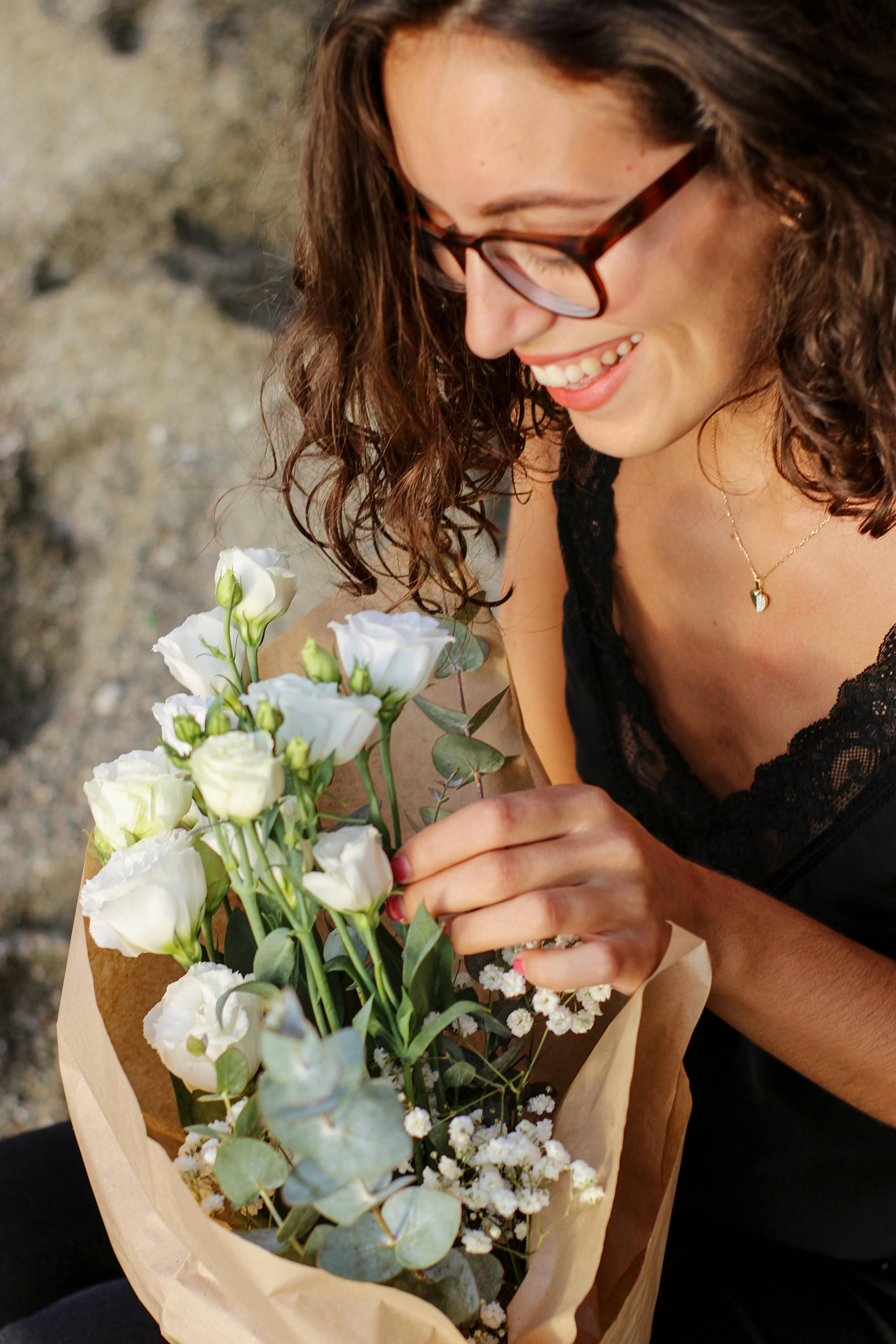 Partly Dressed Woman Sitting on Sofa with Bunch of Red Flowers · Free ...