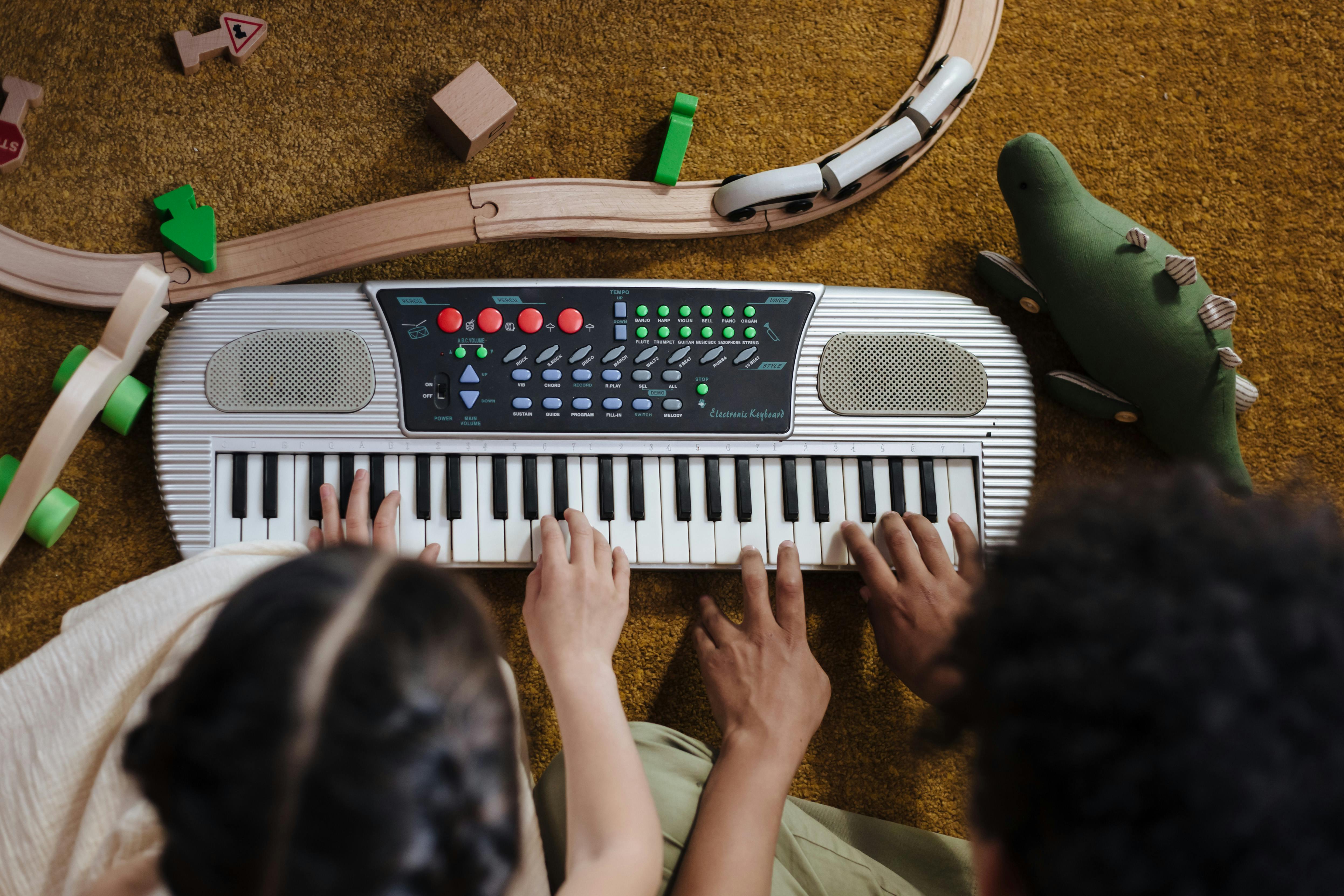 Children Playing Synthesizer Together · Free Stock Photo