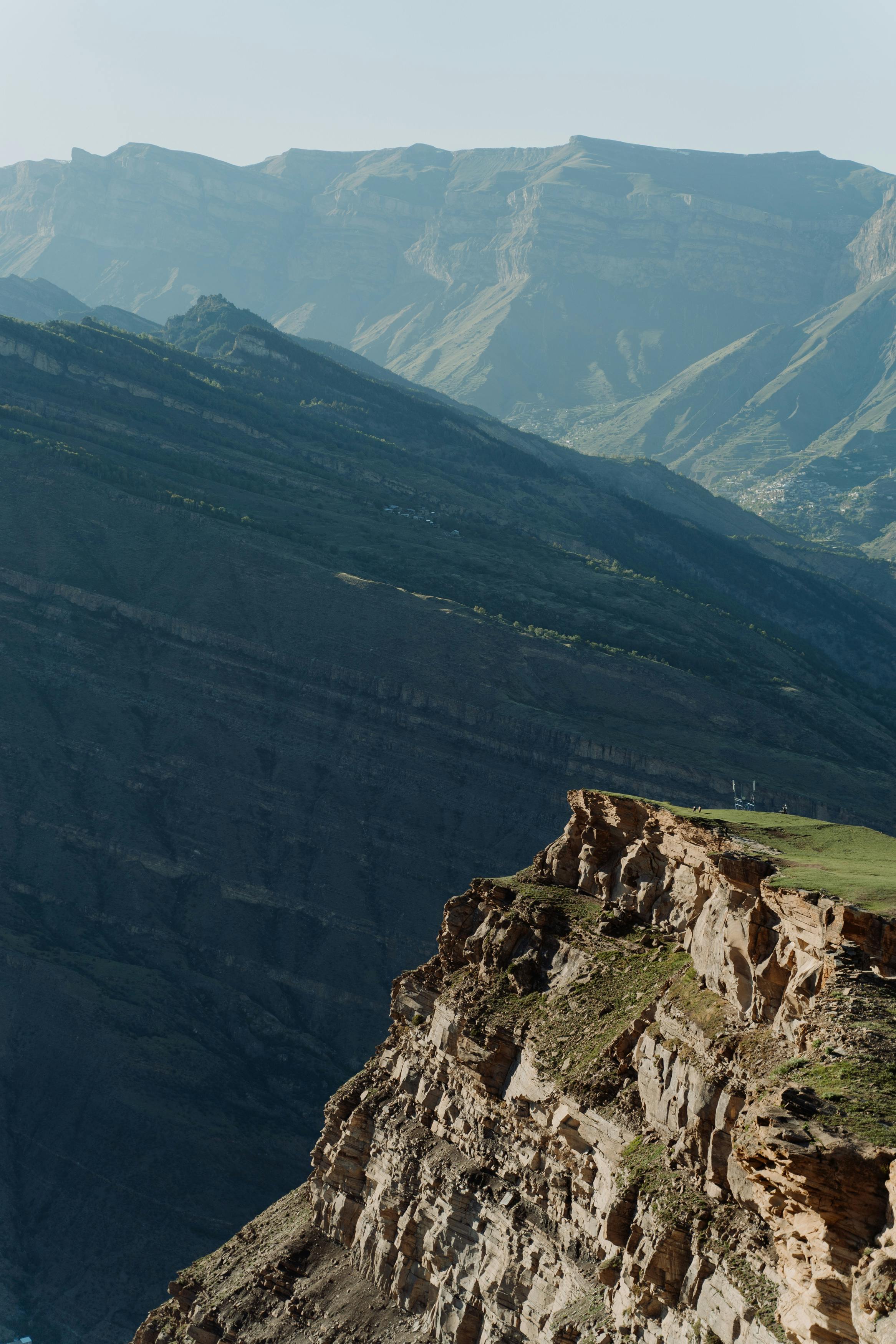 Aerial View of a Cliffside of Green Rocky Mountains · Free Stock Photo