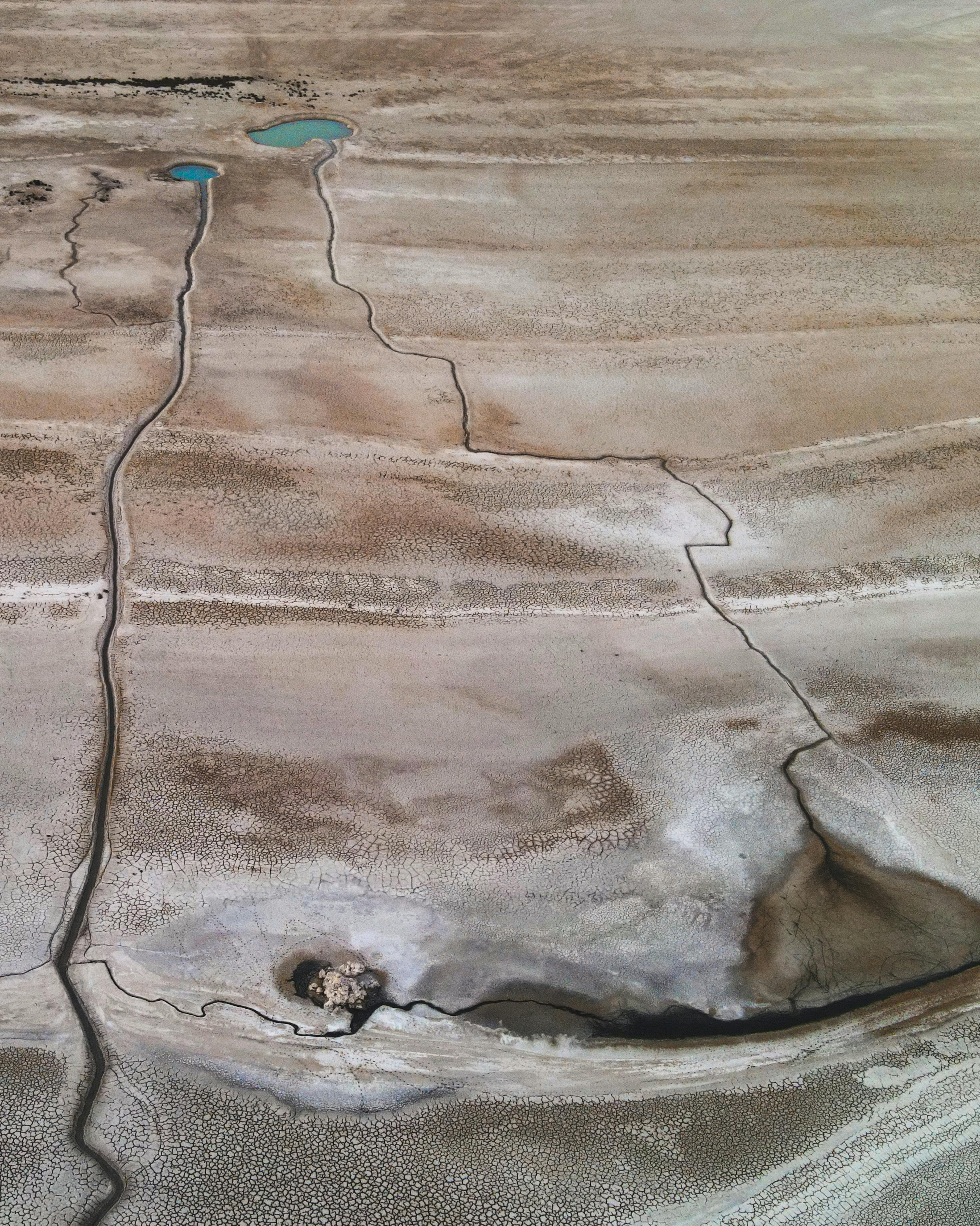 Dry Terrain and Craters on Wasteland · Free Stock Photo