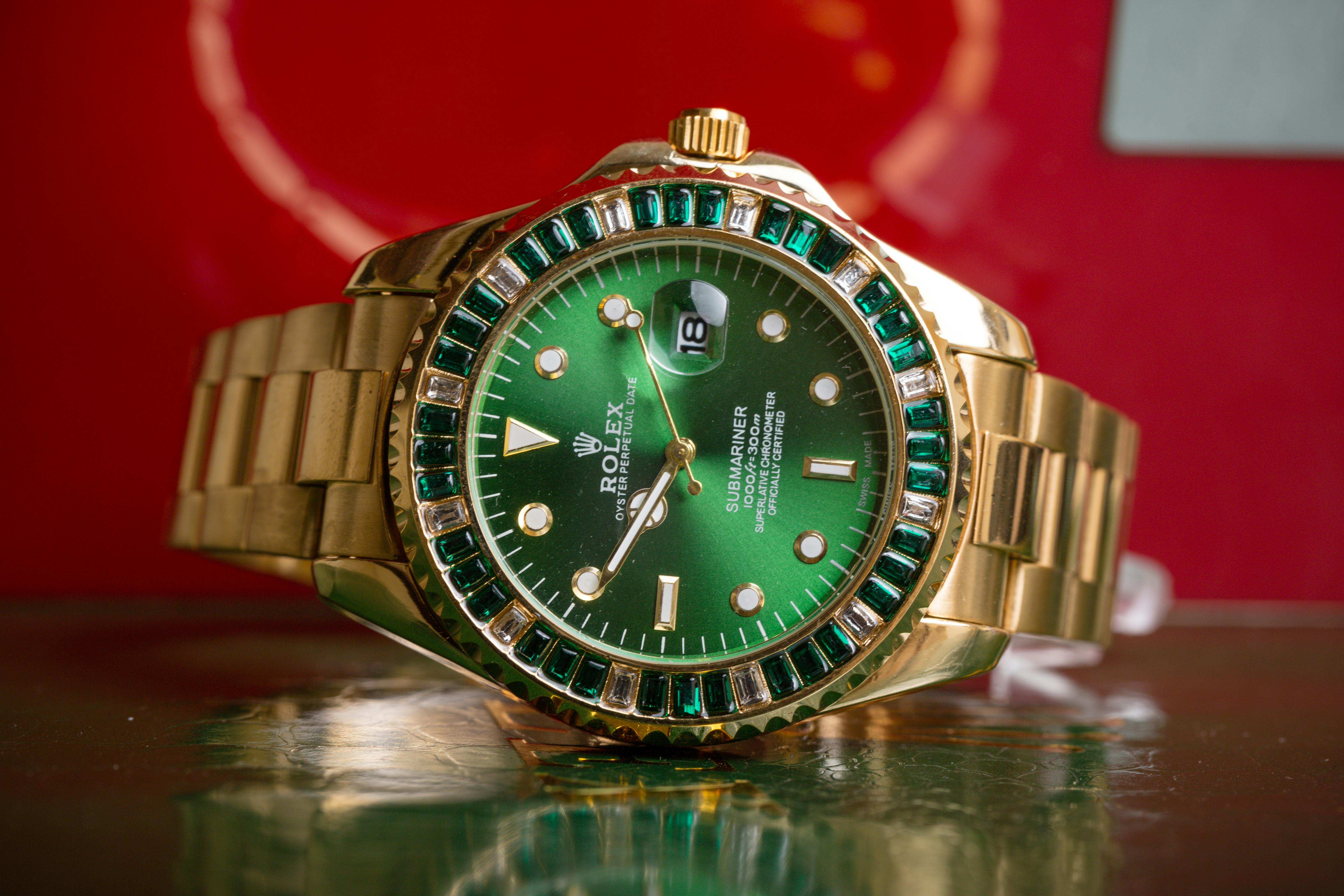 Holding a Rolex Watch · Free Stock Photo