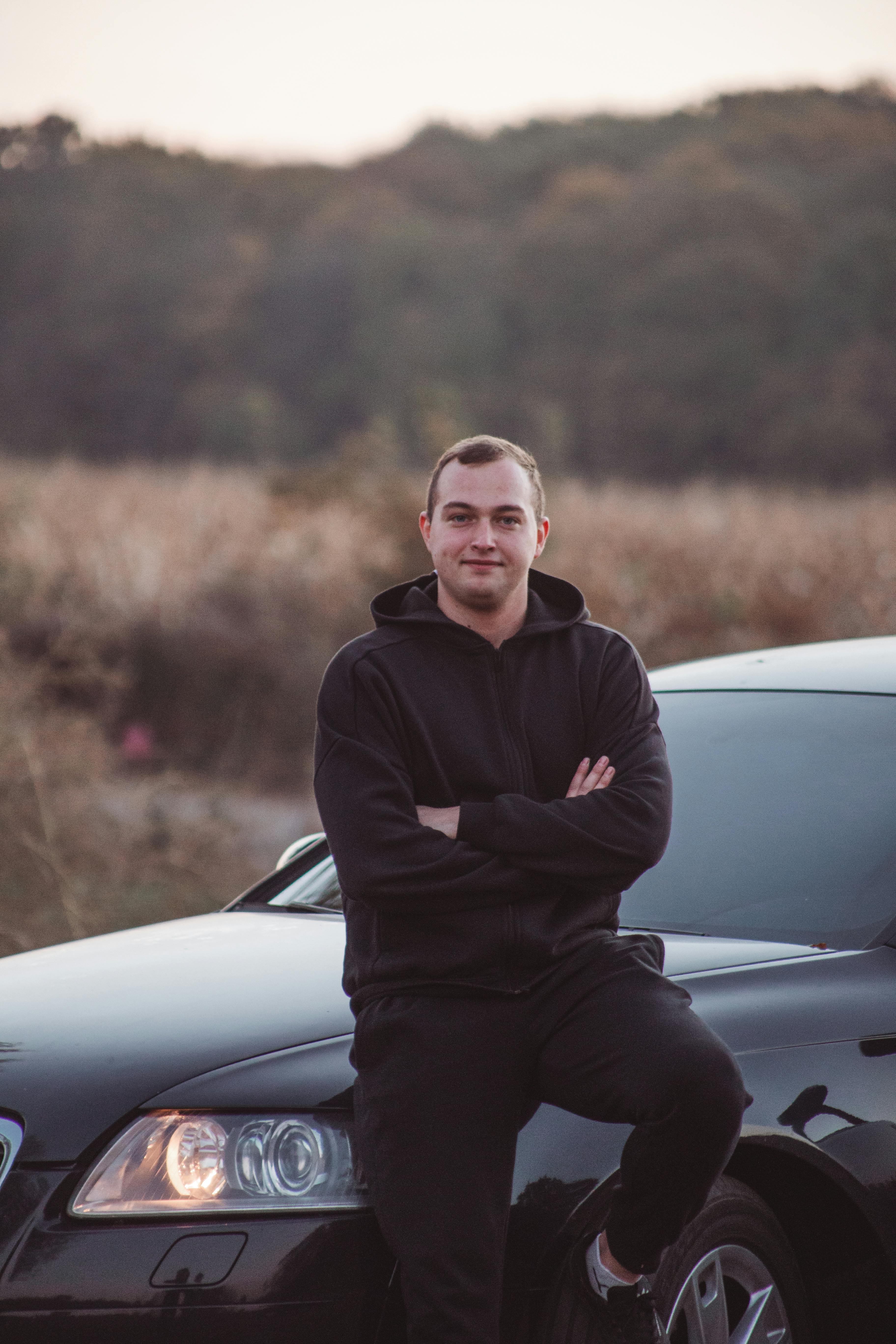 Man Leaning Against Car · Free Stock Photo