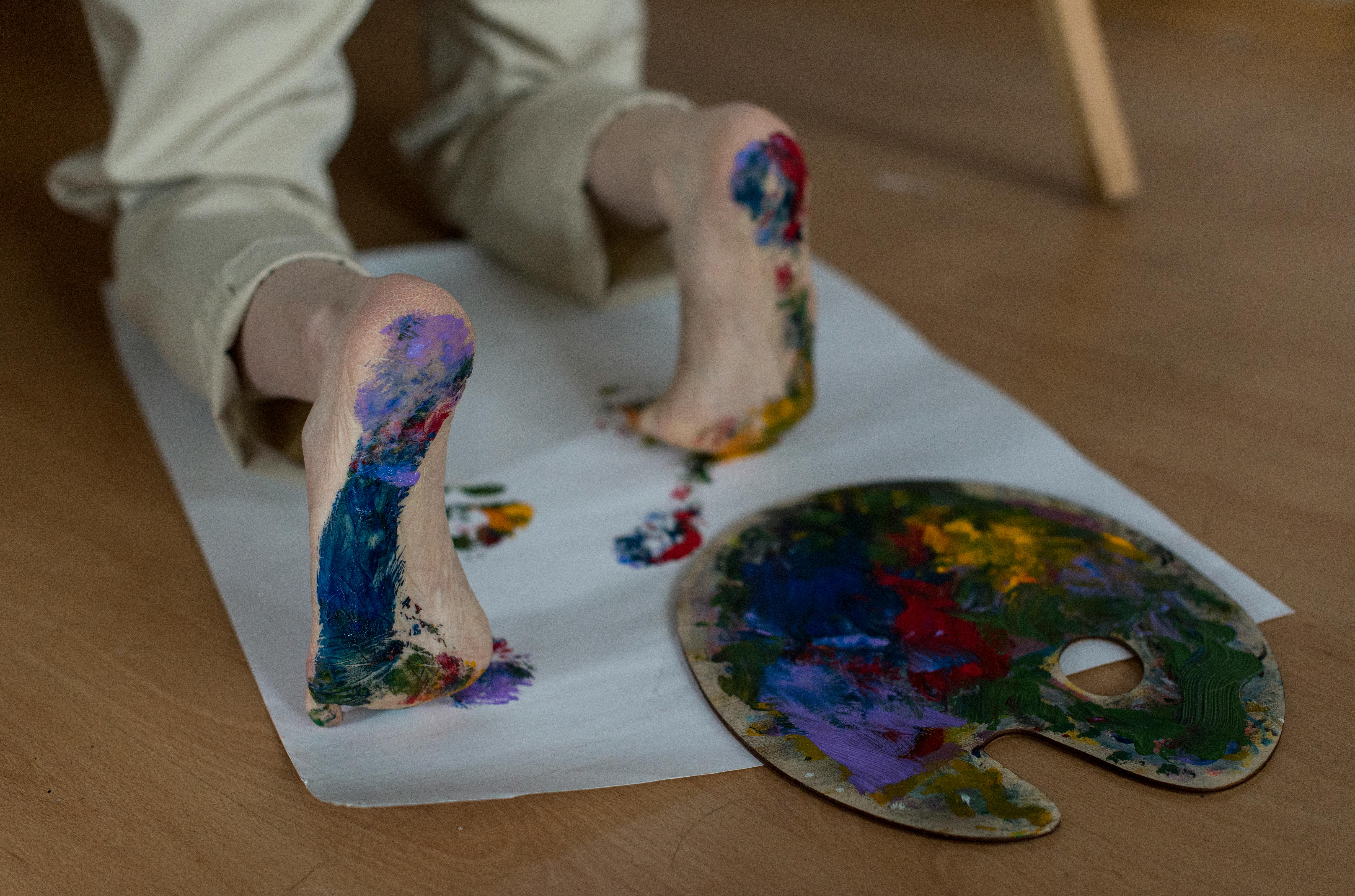 Close-up of Person Painting with Their Feet · Free Stock Photo