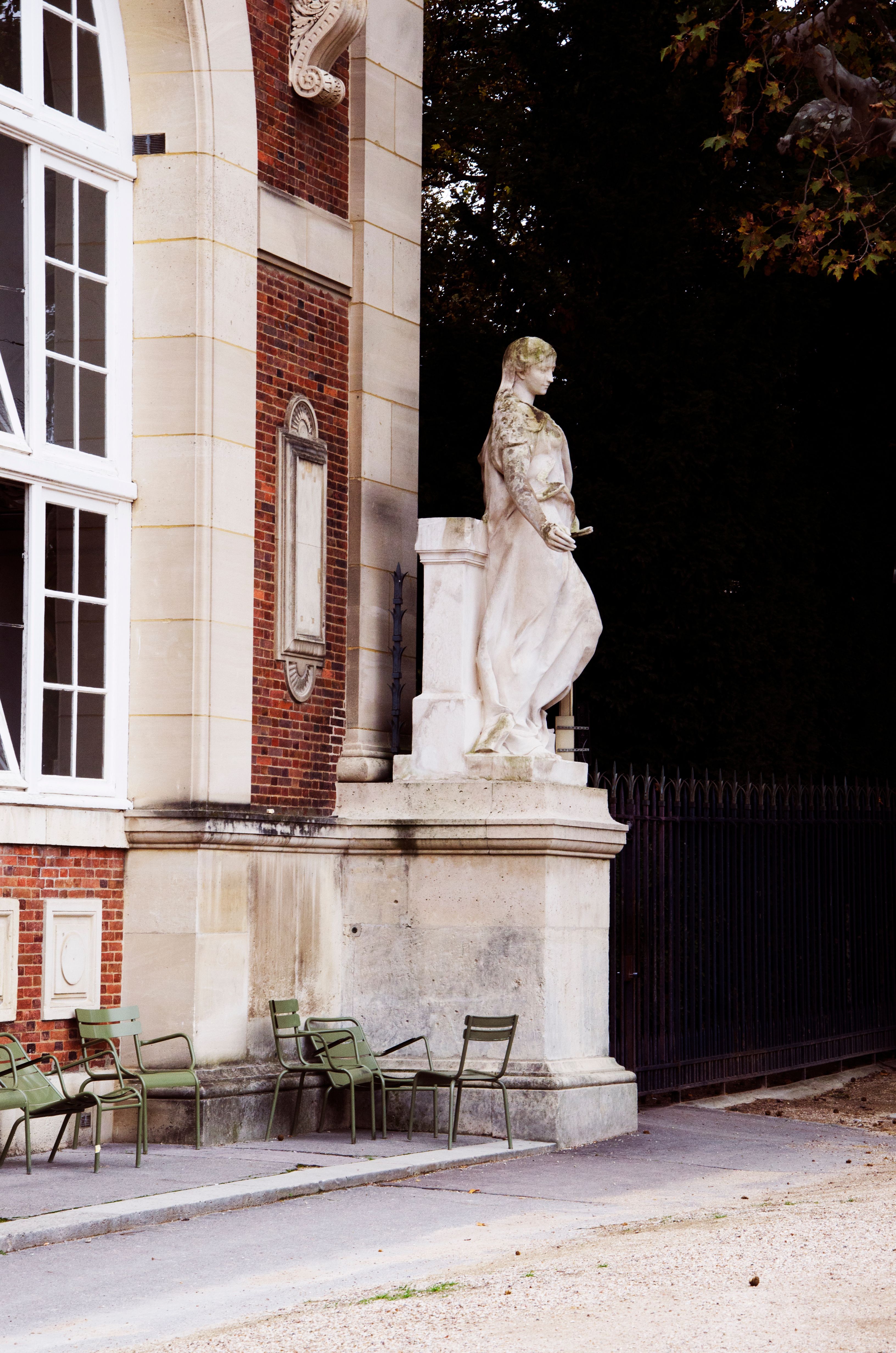 A Statue Near a Building · Free Stock Photo