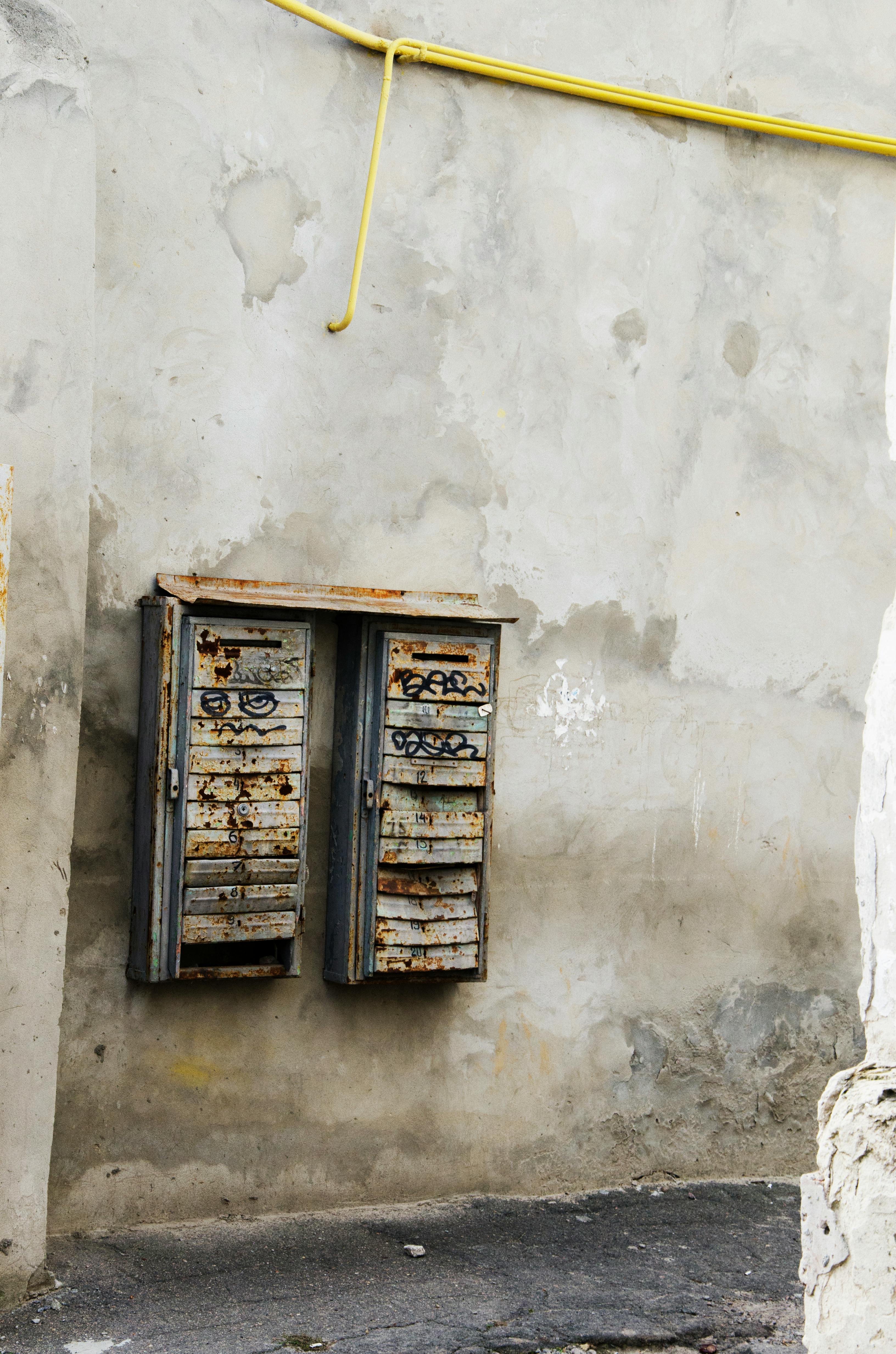 Rusty Letterbox on Concrete Wall · Free Stock Photo