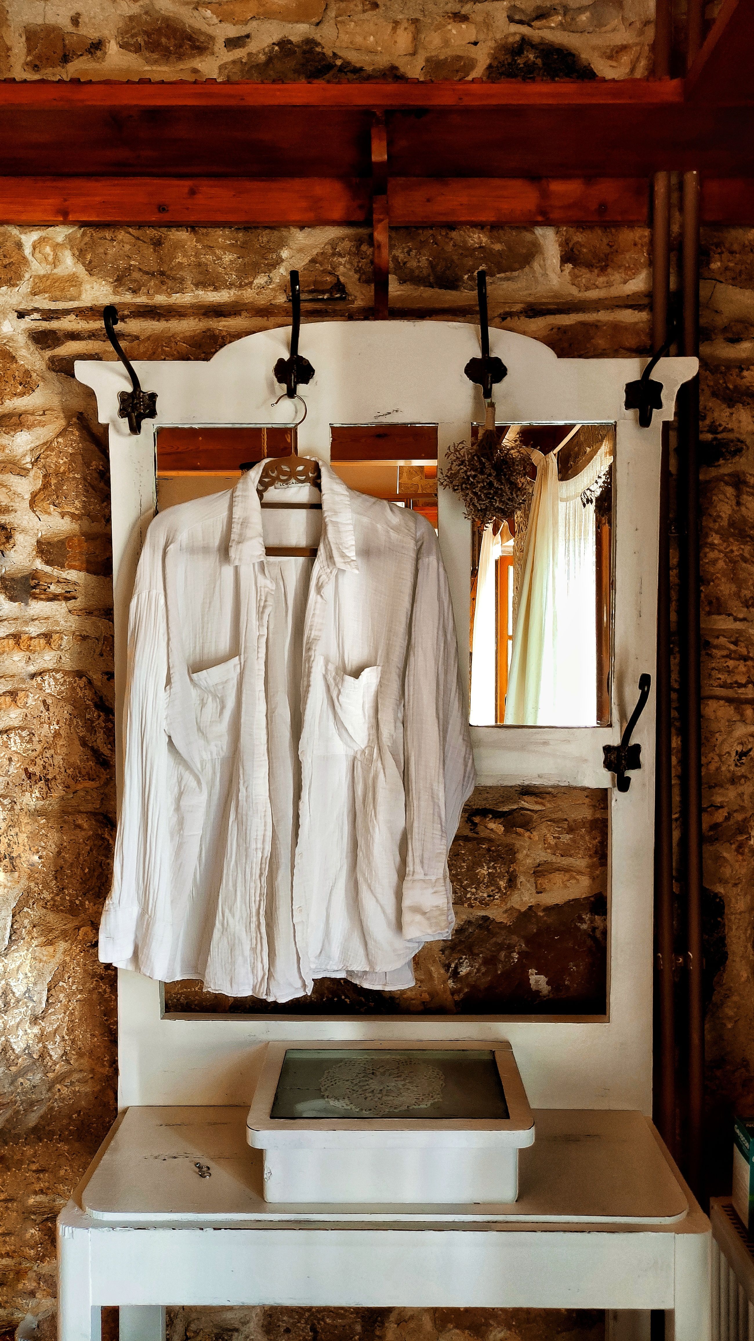 Blue Button Up Shirt Hanging on White Metal Bar · Free Stock Photo
