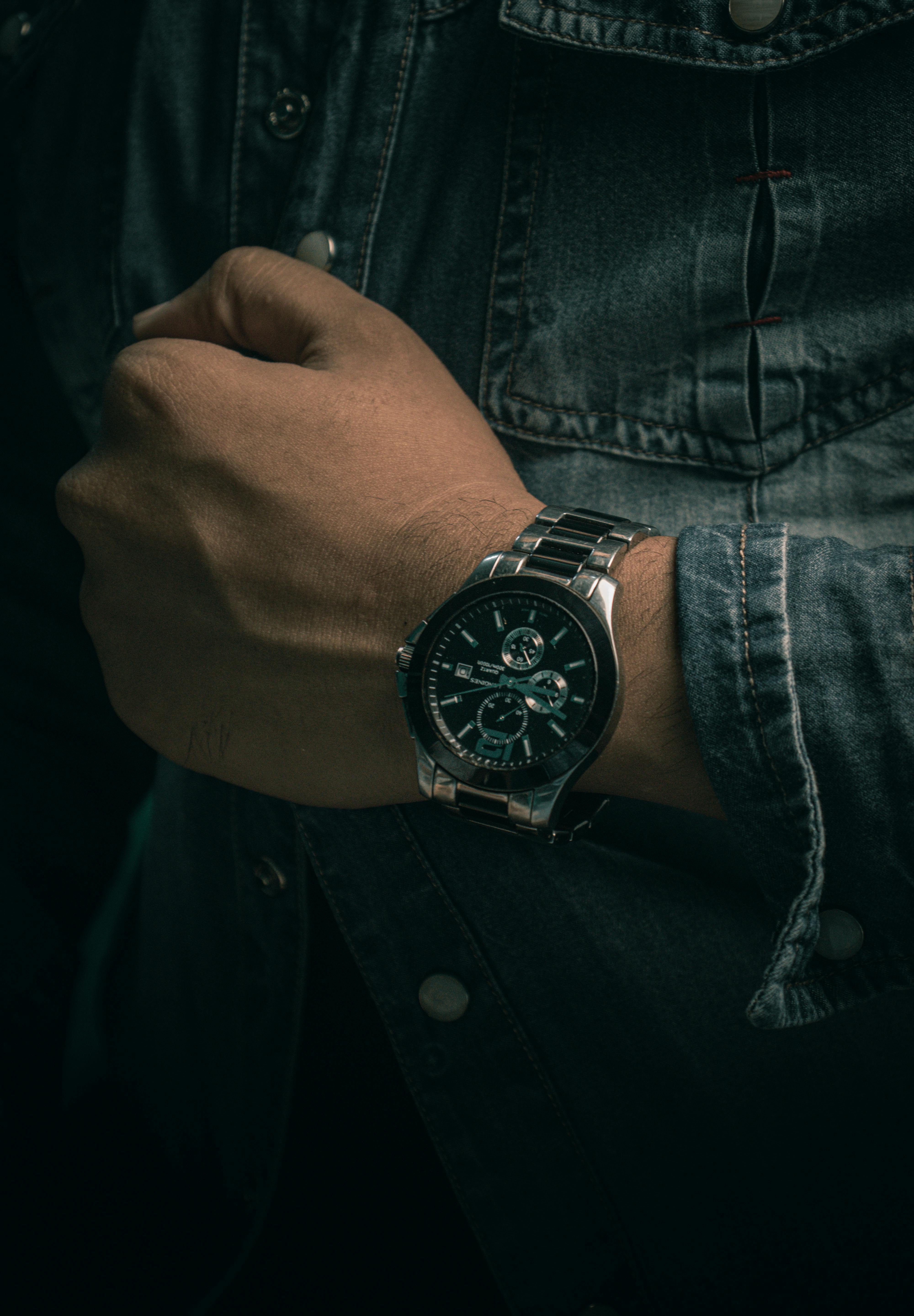 Person Wearing Blue Denim Jeans and Black Watch · Free Stock Photo