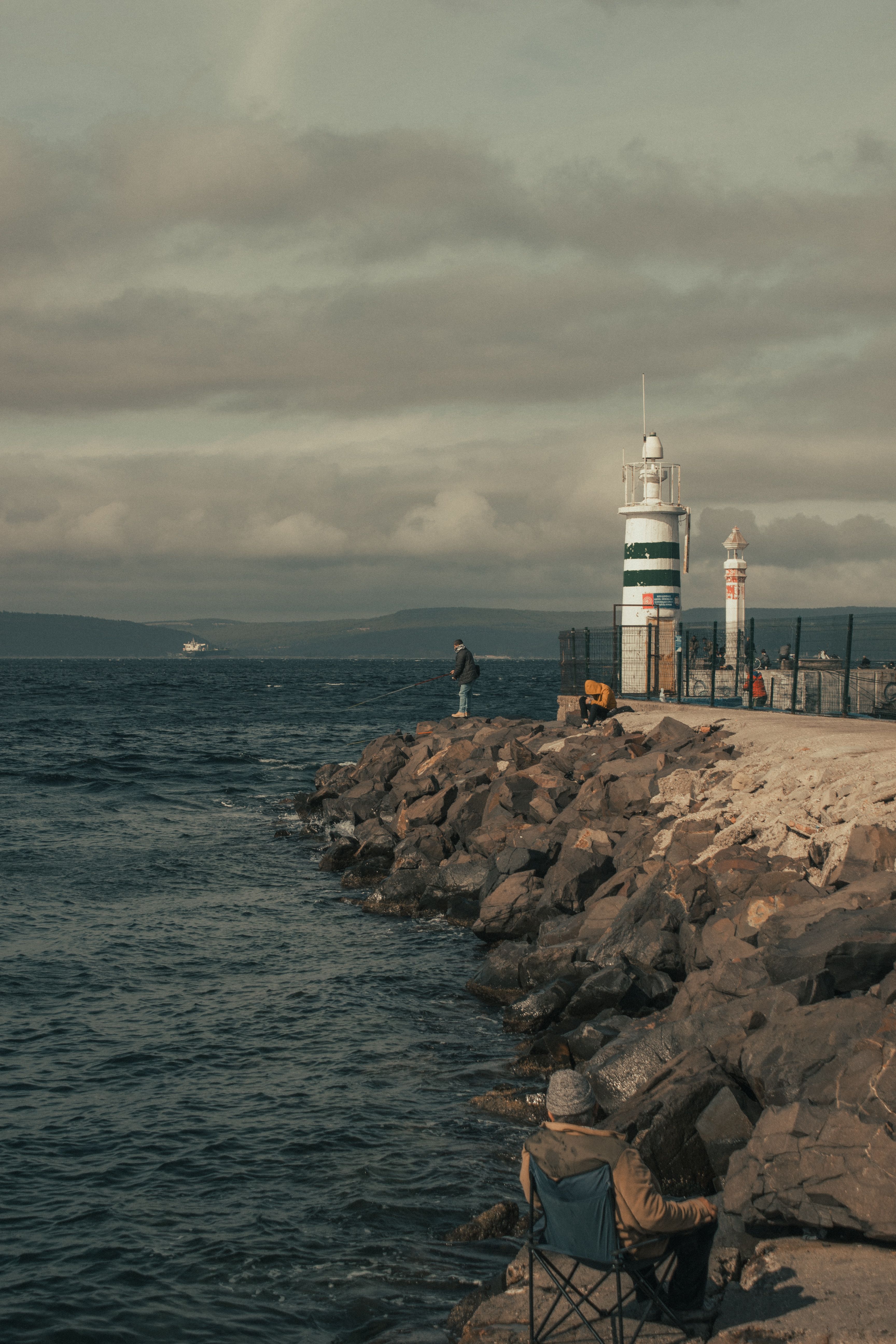Lighthouse on Sea Shore · Free Stock Photo