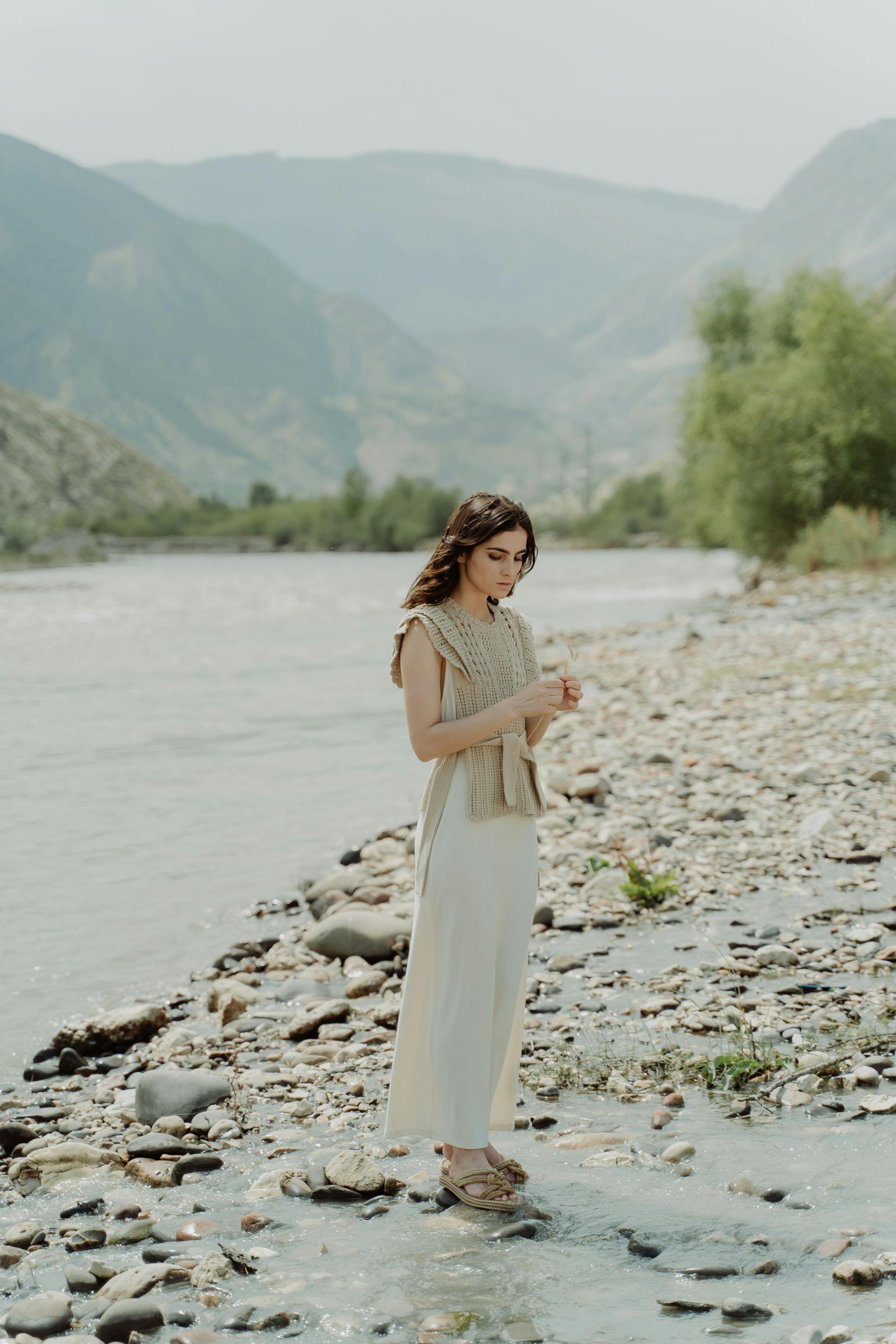A Woman Standing near a River · Free Stock Photo