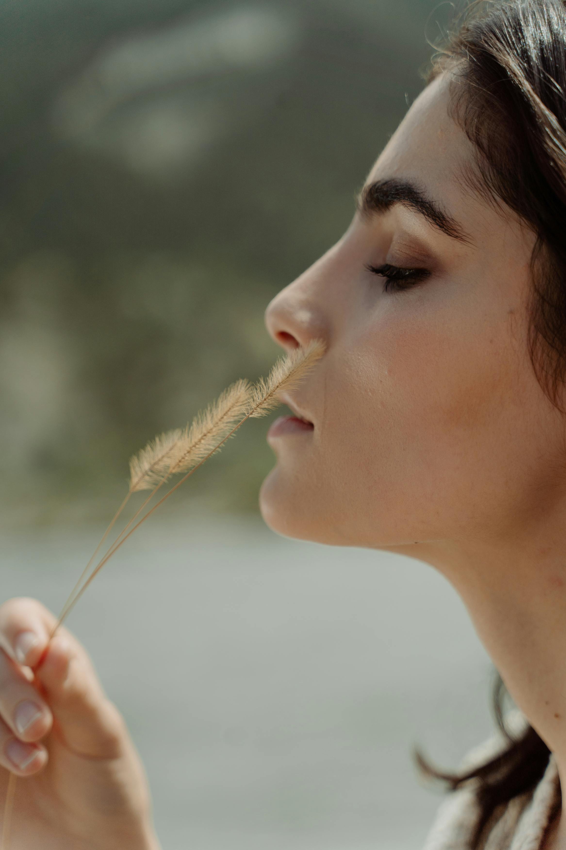 Woman Putting Grass on Face · Free Stock Photo