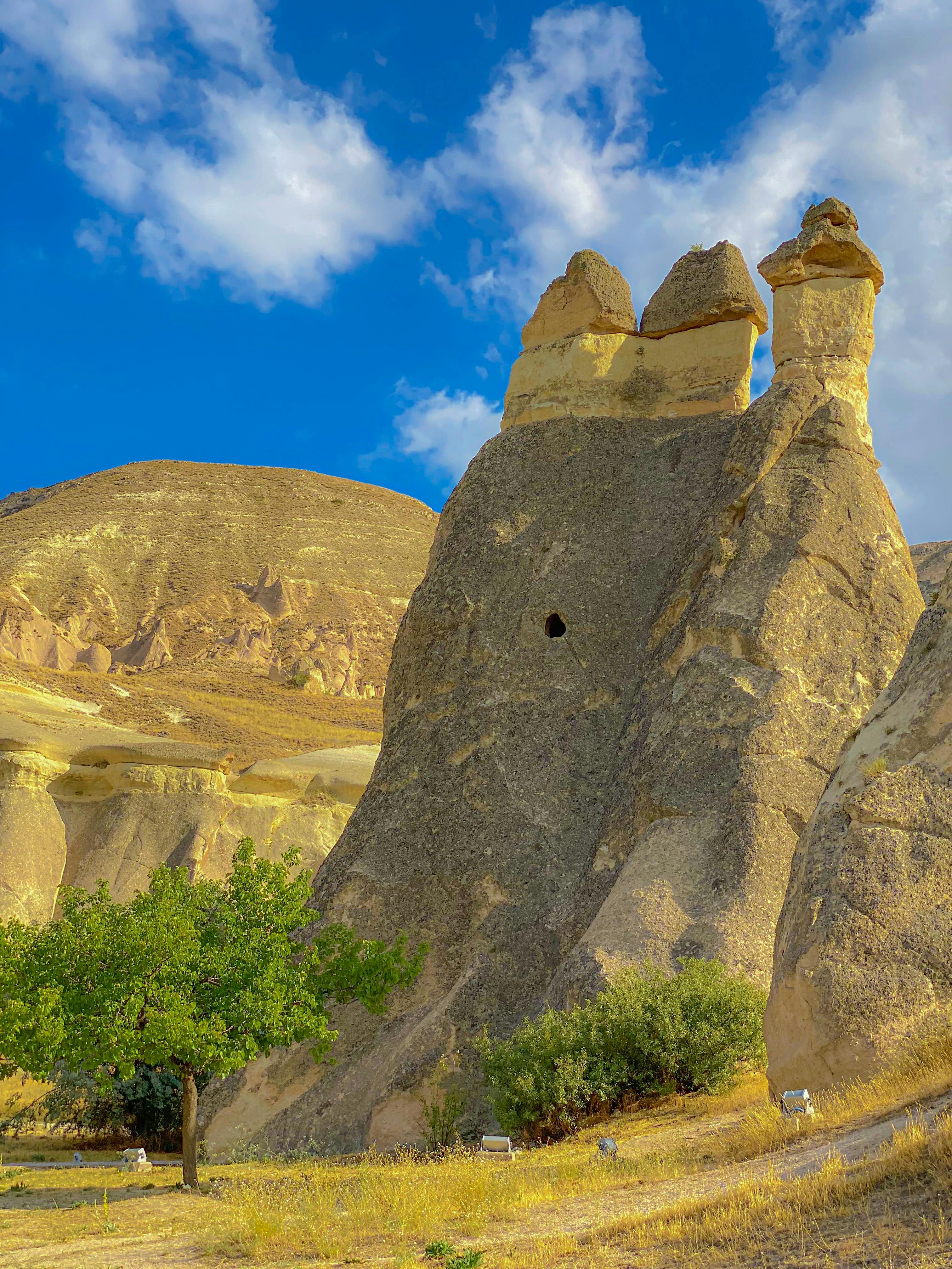 Brown and Black Rock Formation on Water · Free Stock Photo
