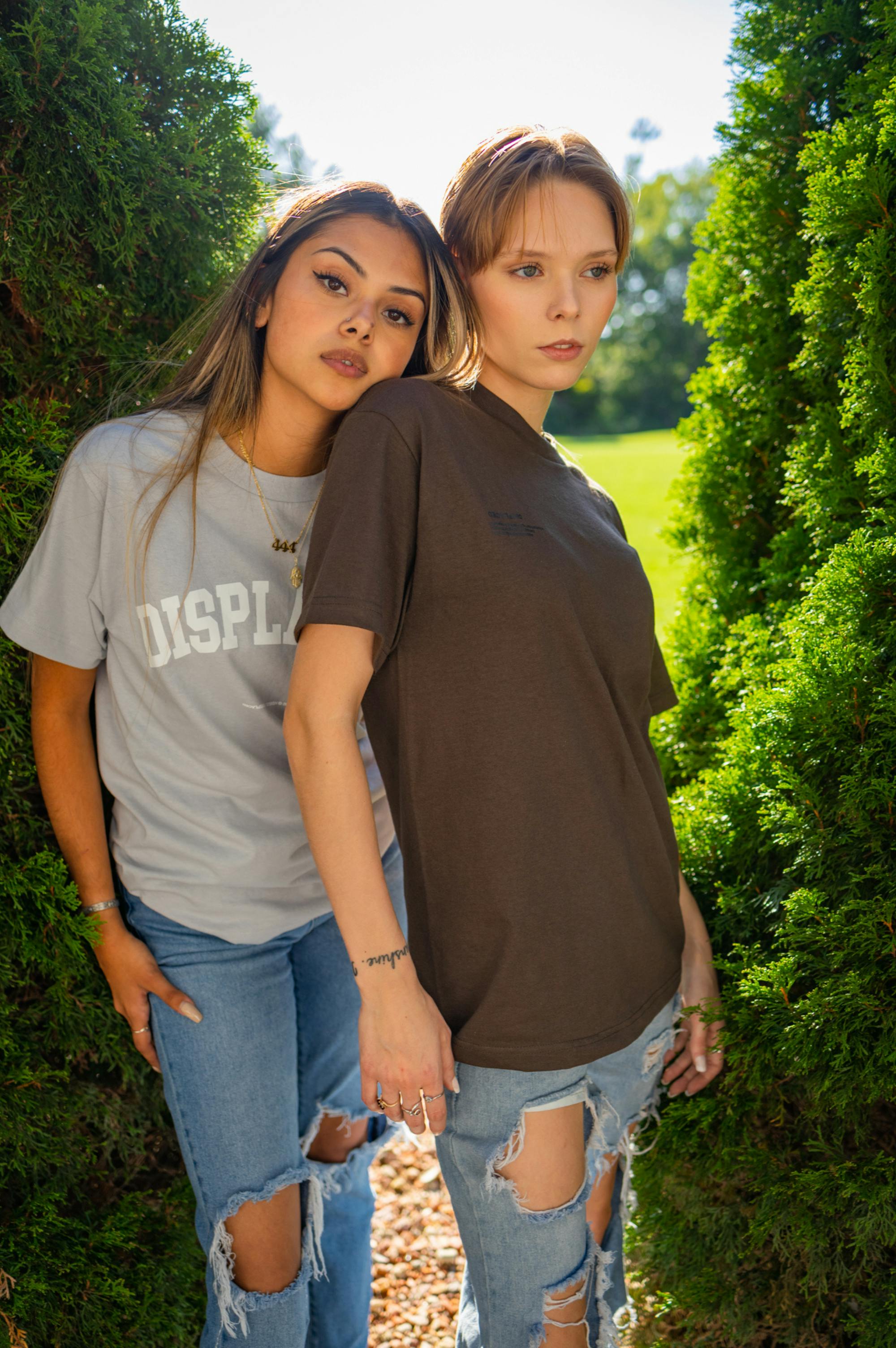 Stylish Women in Tattered Jeans · Free Stock Photo